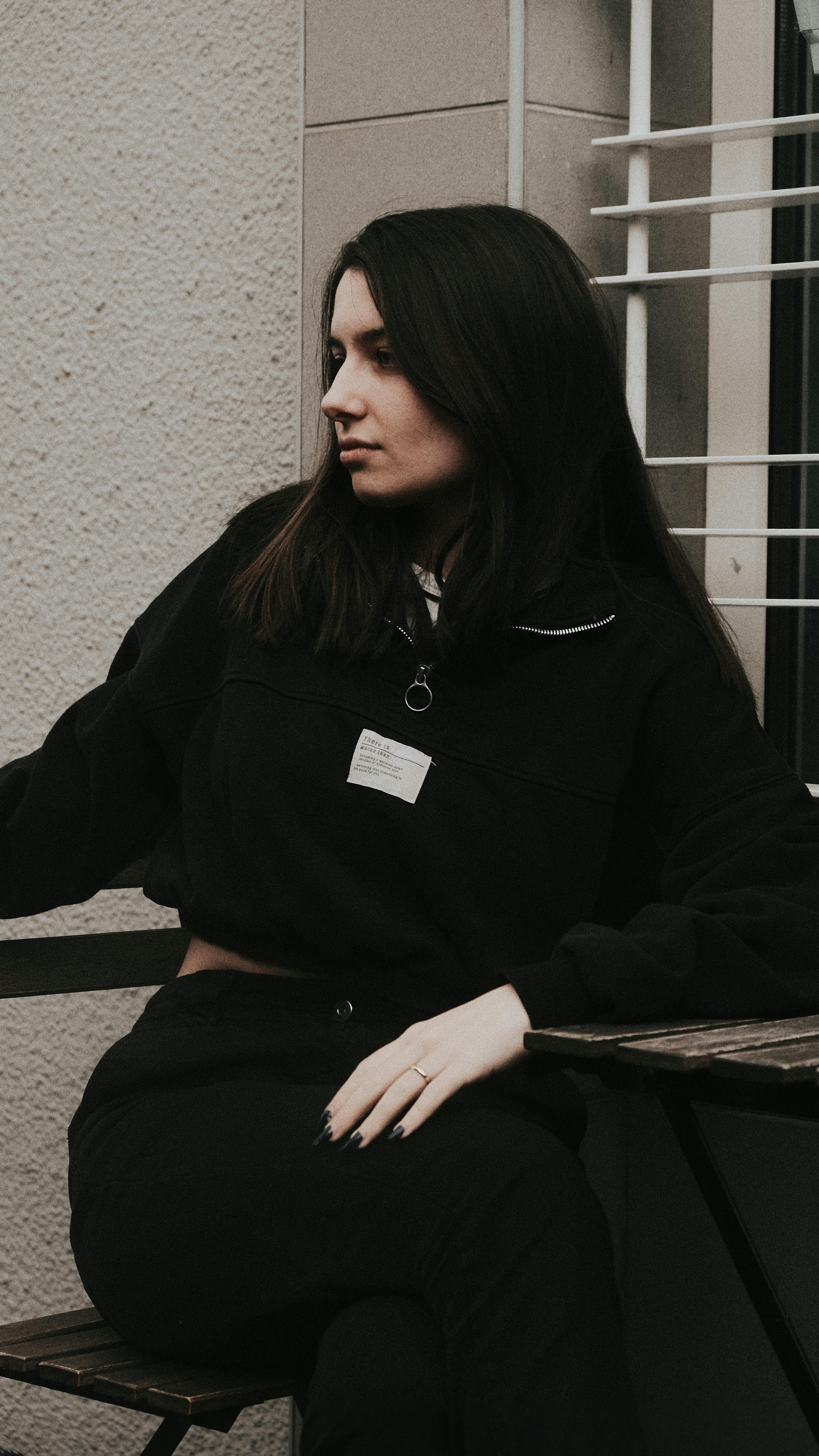 Black and White Portrait of Woman Looking Over Shoulder · Free Stock Photo