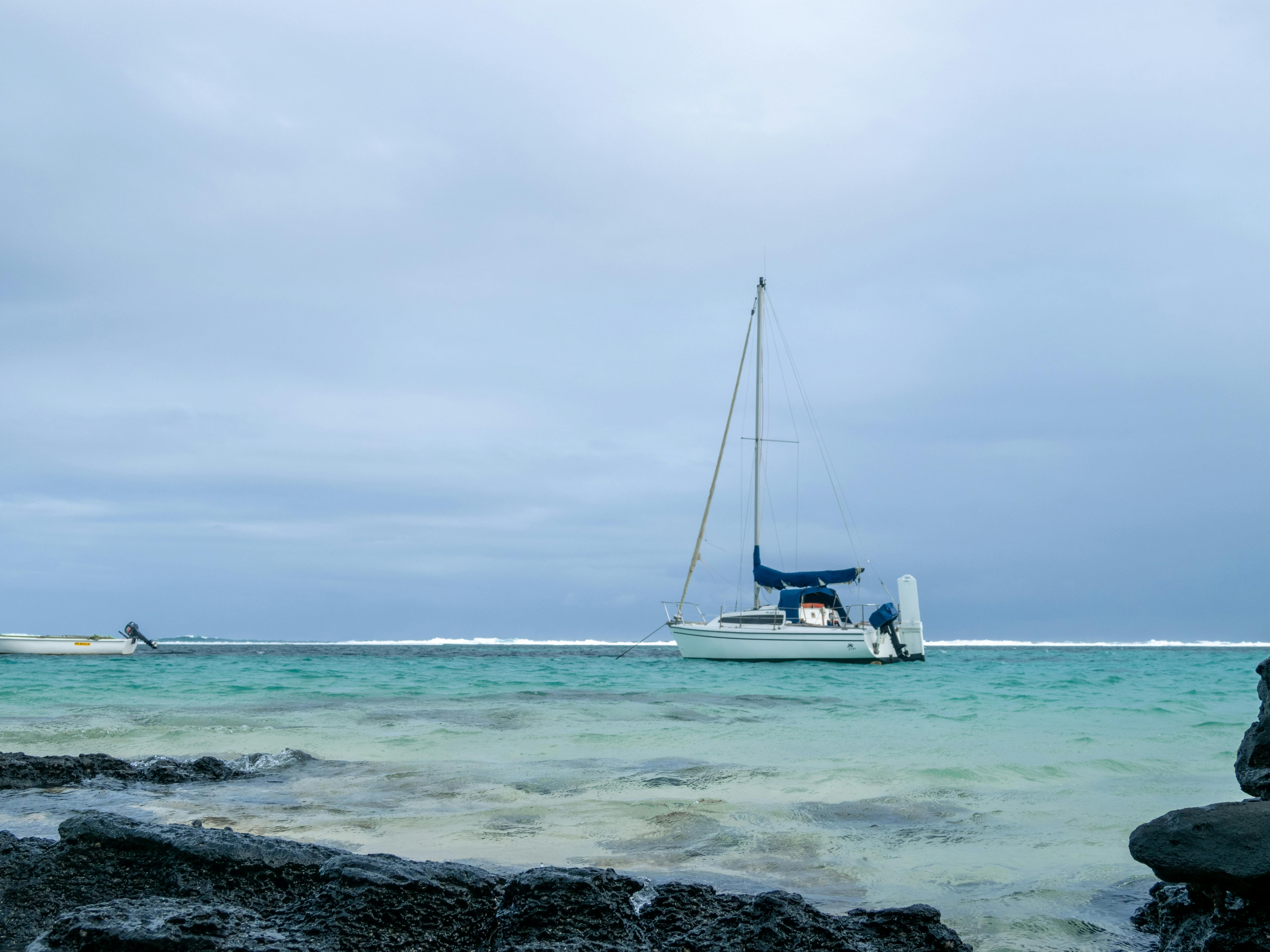 Sailboat Anchored on Sea · Free Stock Photo