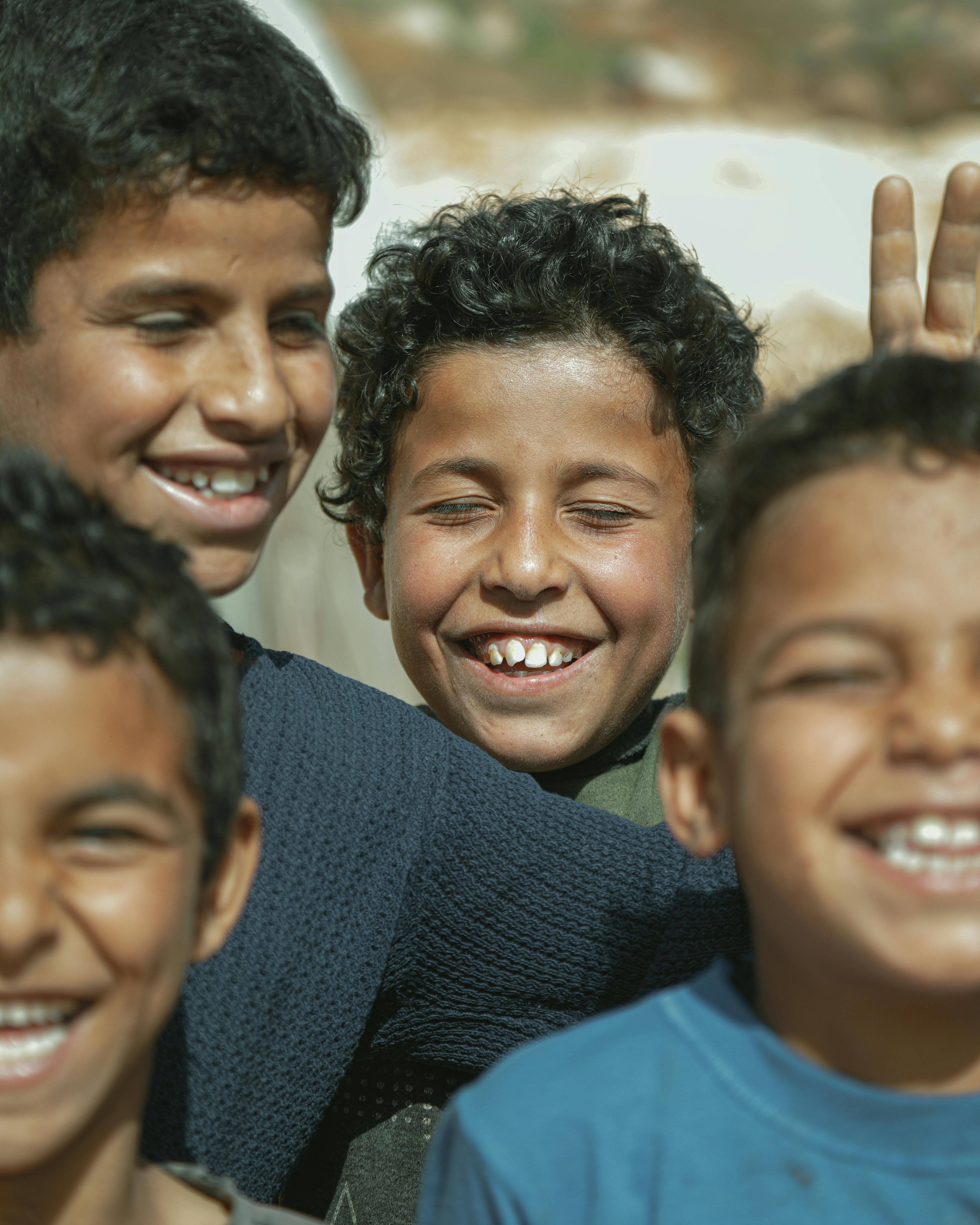 2 Kid's in Gray Concrete Container during Daytime · Free Stock Photo