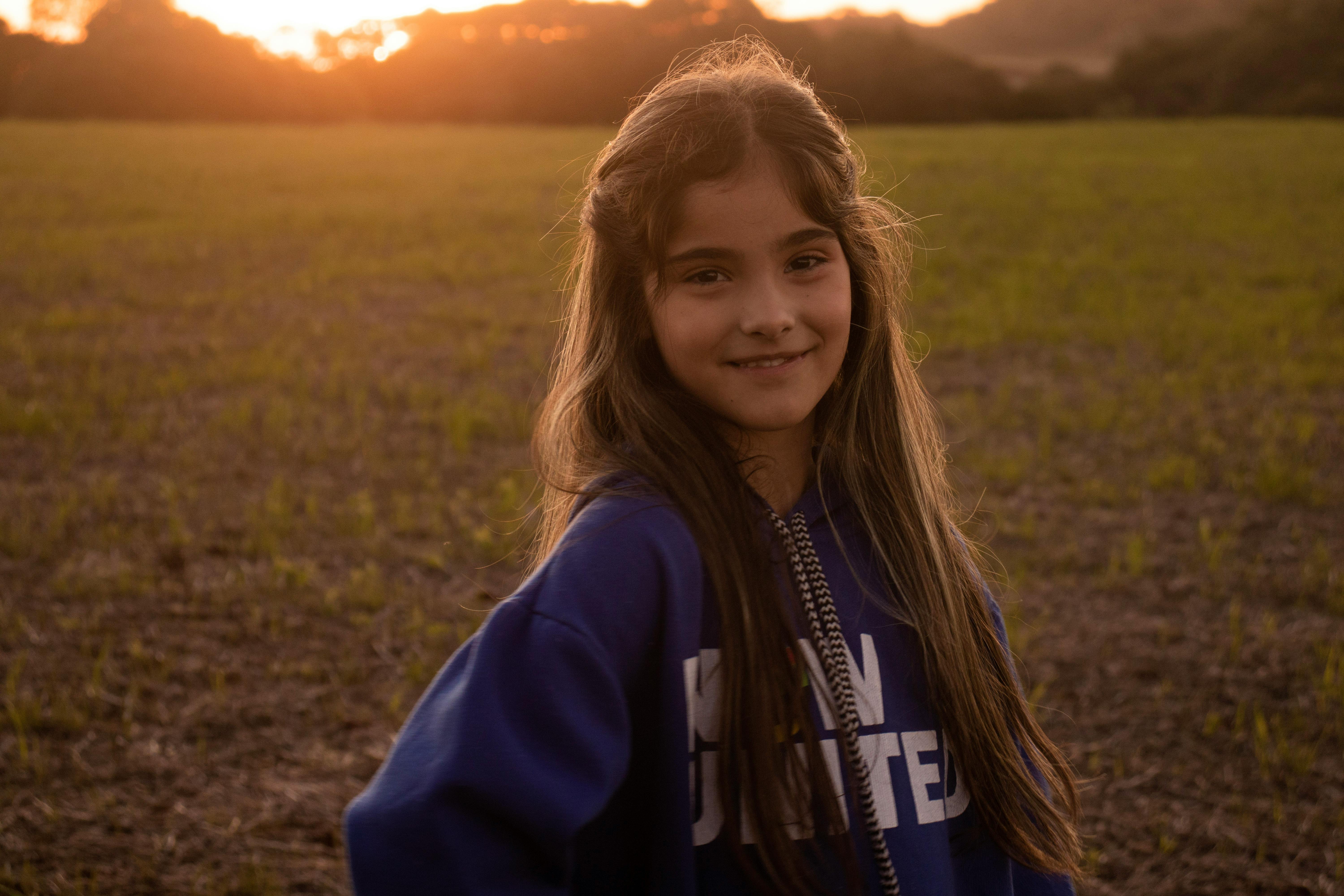 Girl Smiling Wearing Blue Jacket · Free Stock Photo