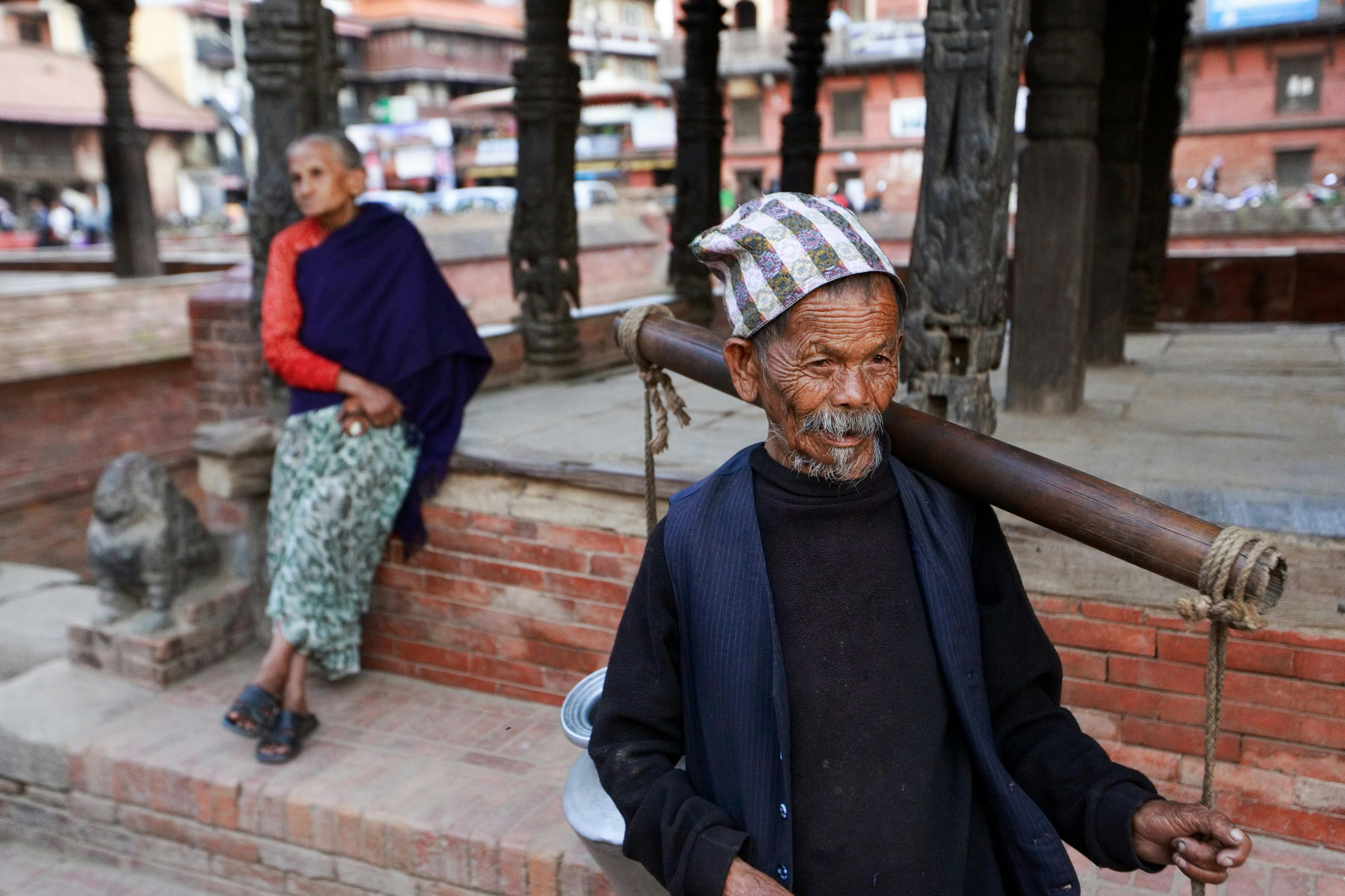Man with a Carrying Pole · Free Stock Photo