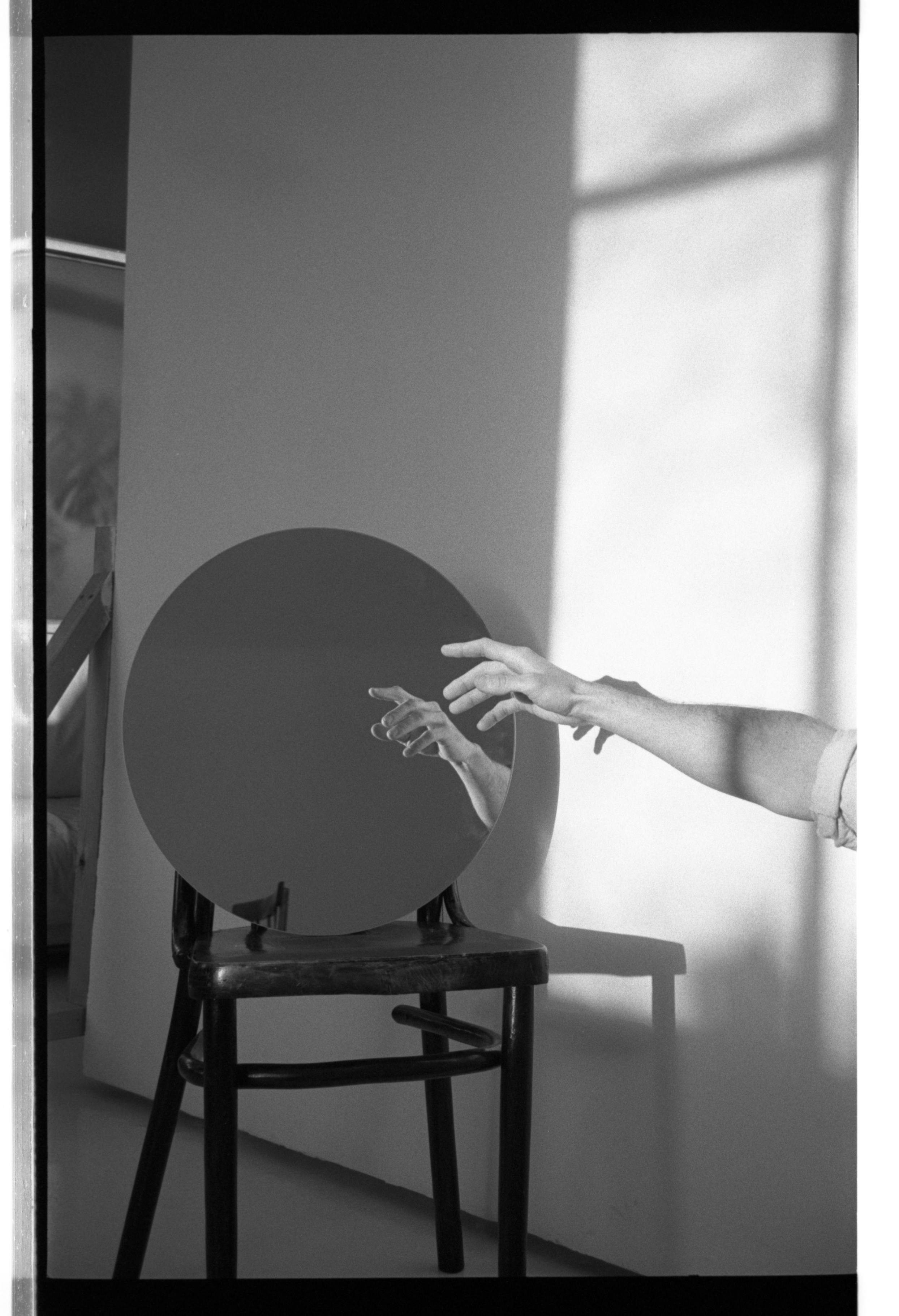 Hand Reflected in Mirror on Chair · Free Stock Photo