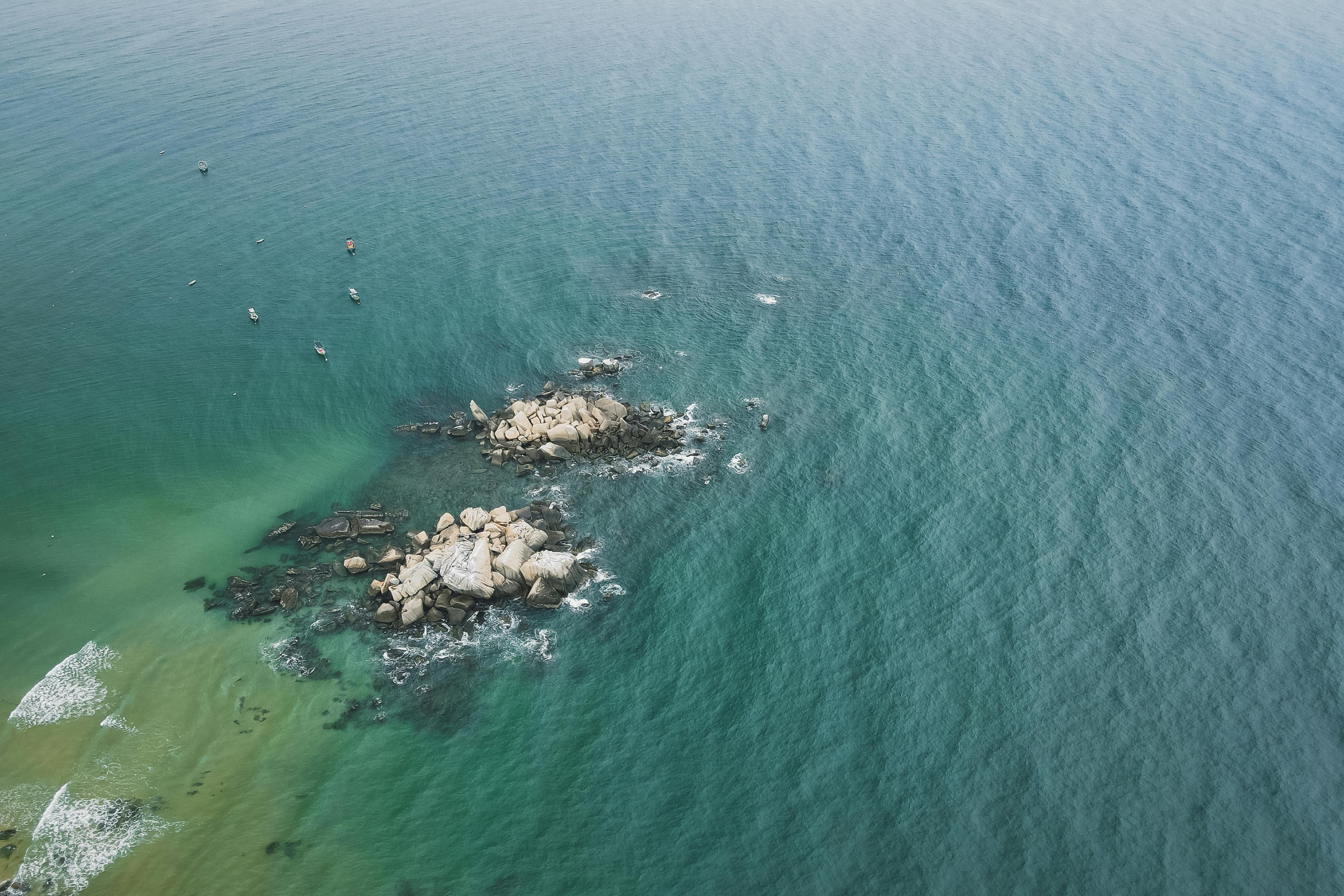 Rocks Protruding From Sea · Free Stock Photo
