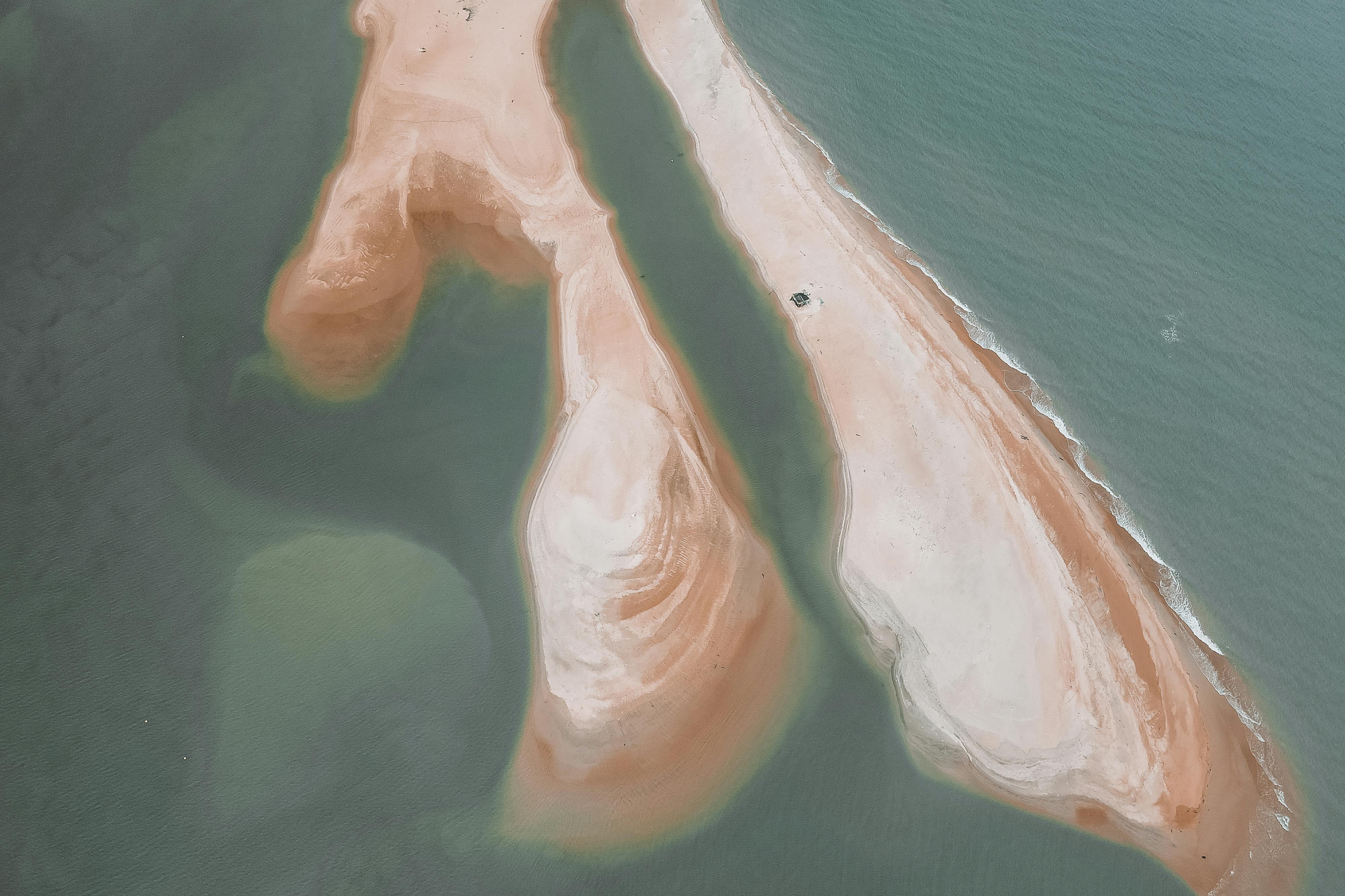 Aerial View of a Sandy Peninsula · Free Stock Photo