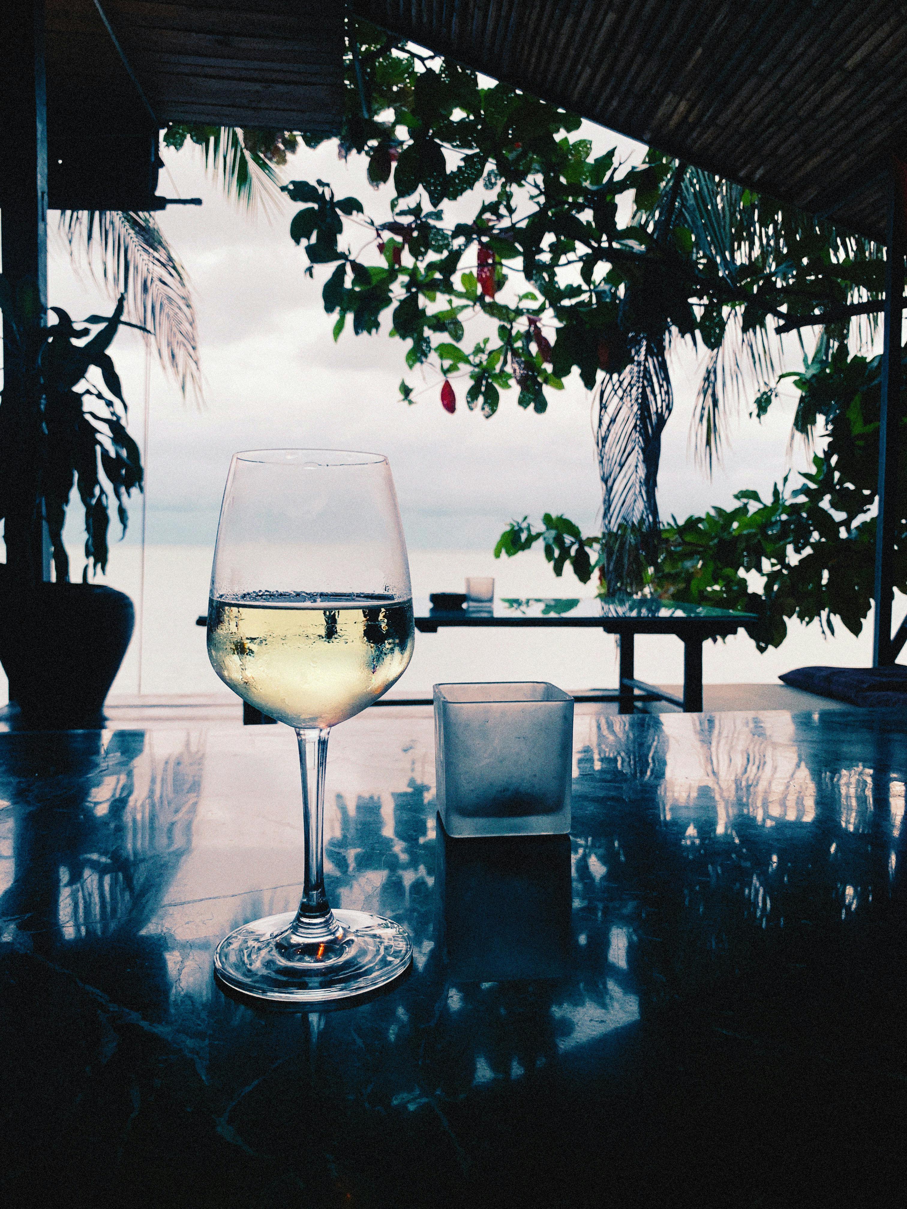 A Glass of Wine on a Table · Free Stock Photo