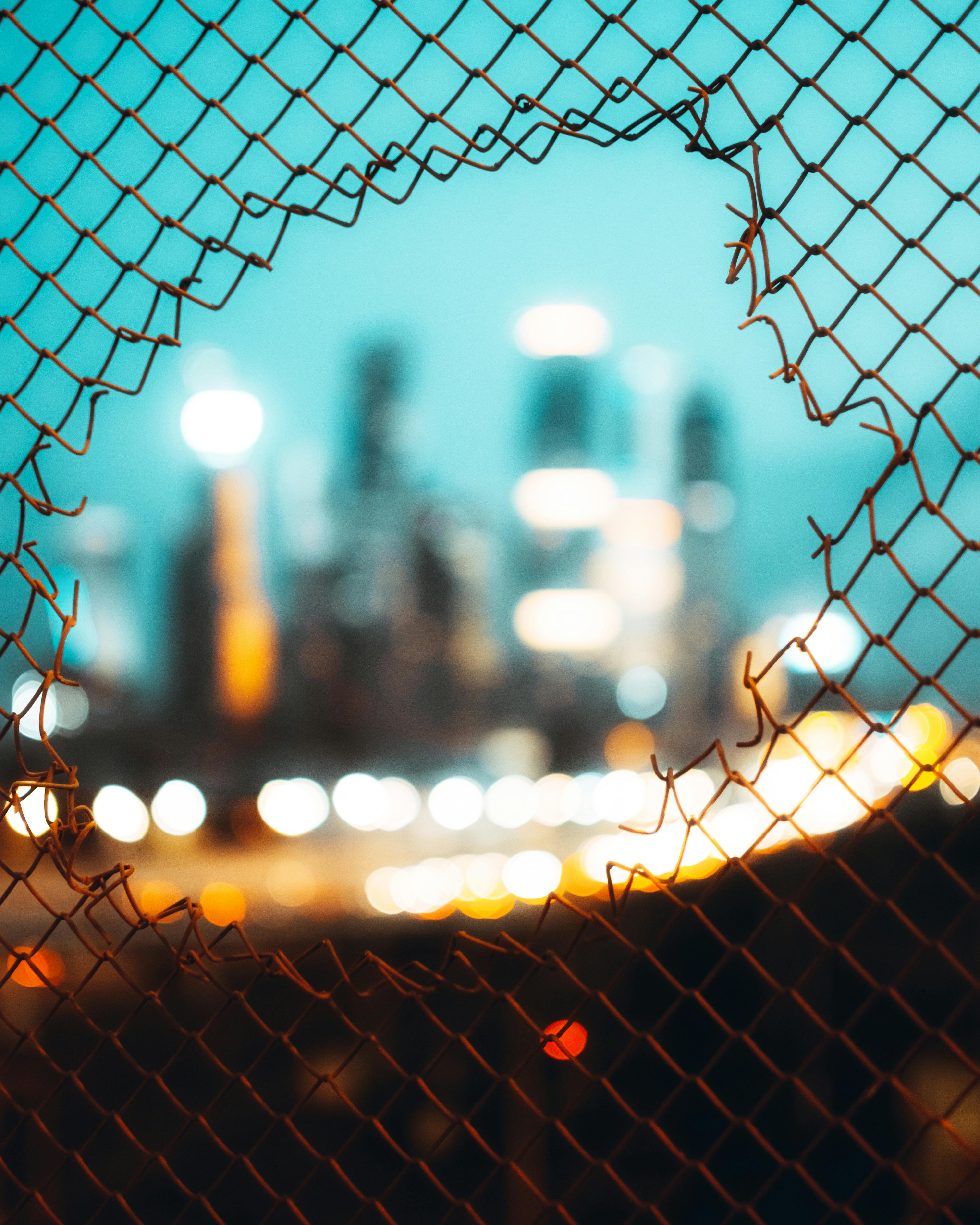 Close Up Photo of Broken Chain Link Fence · Free Stock Photo