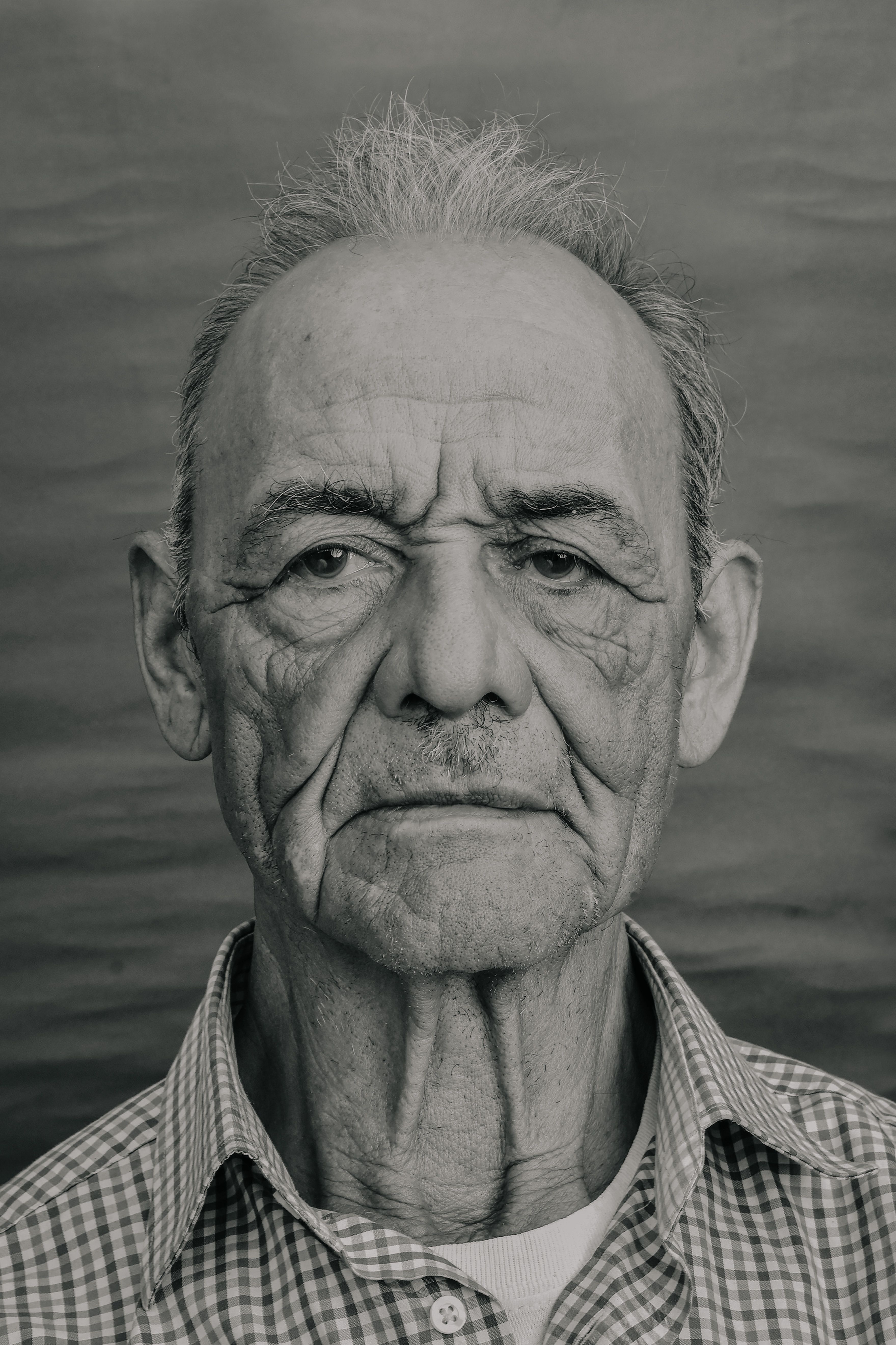 Elderly Man with Hat Holding String · Free Stock Photo