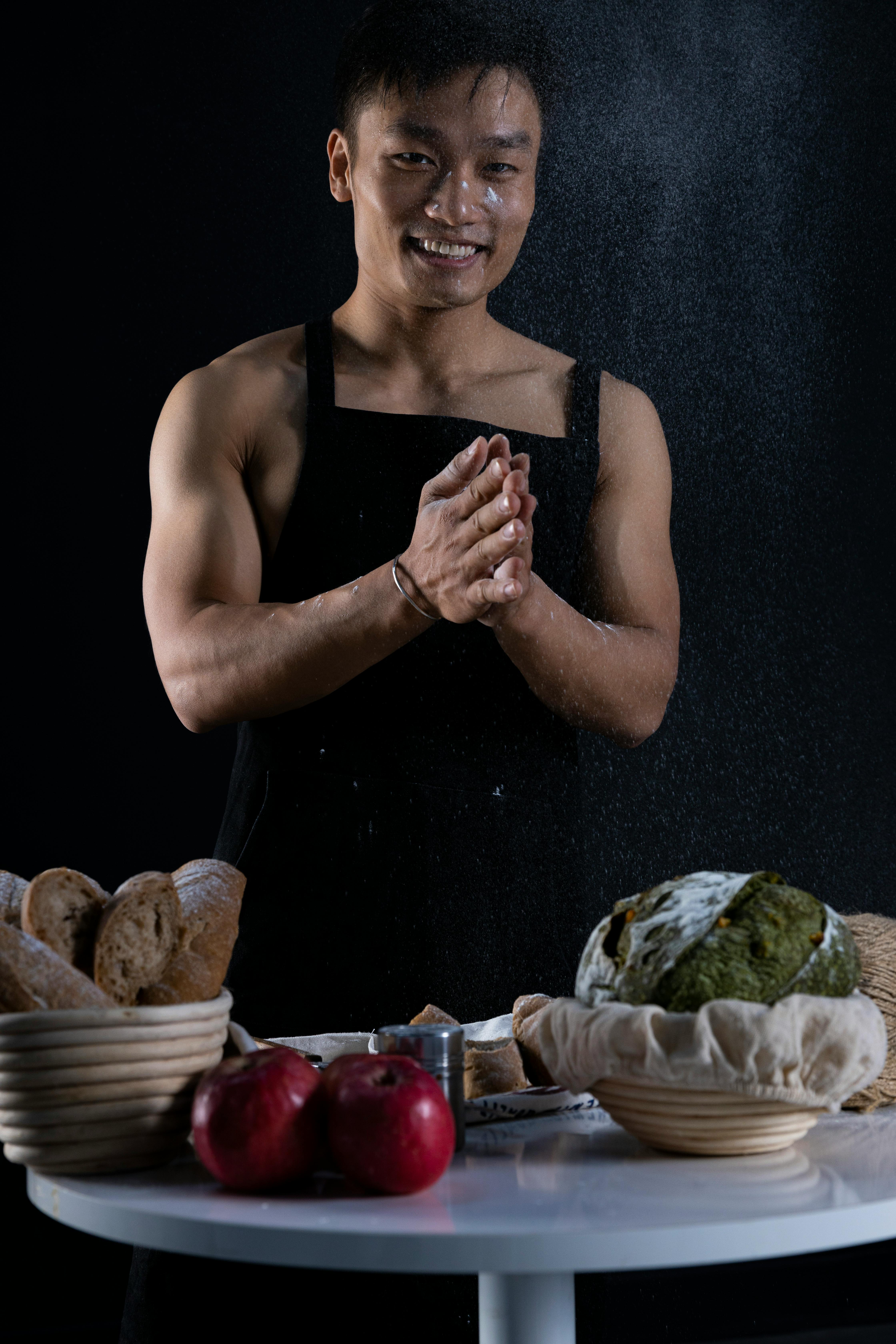 Smiling Shirtless Cook in Apron Standing by Table with Food · Free ...