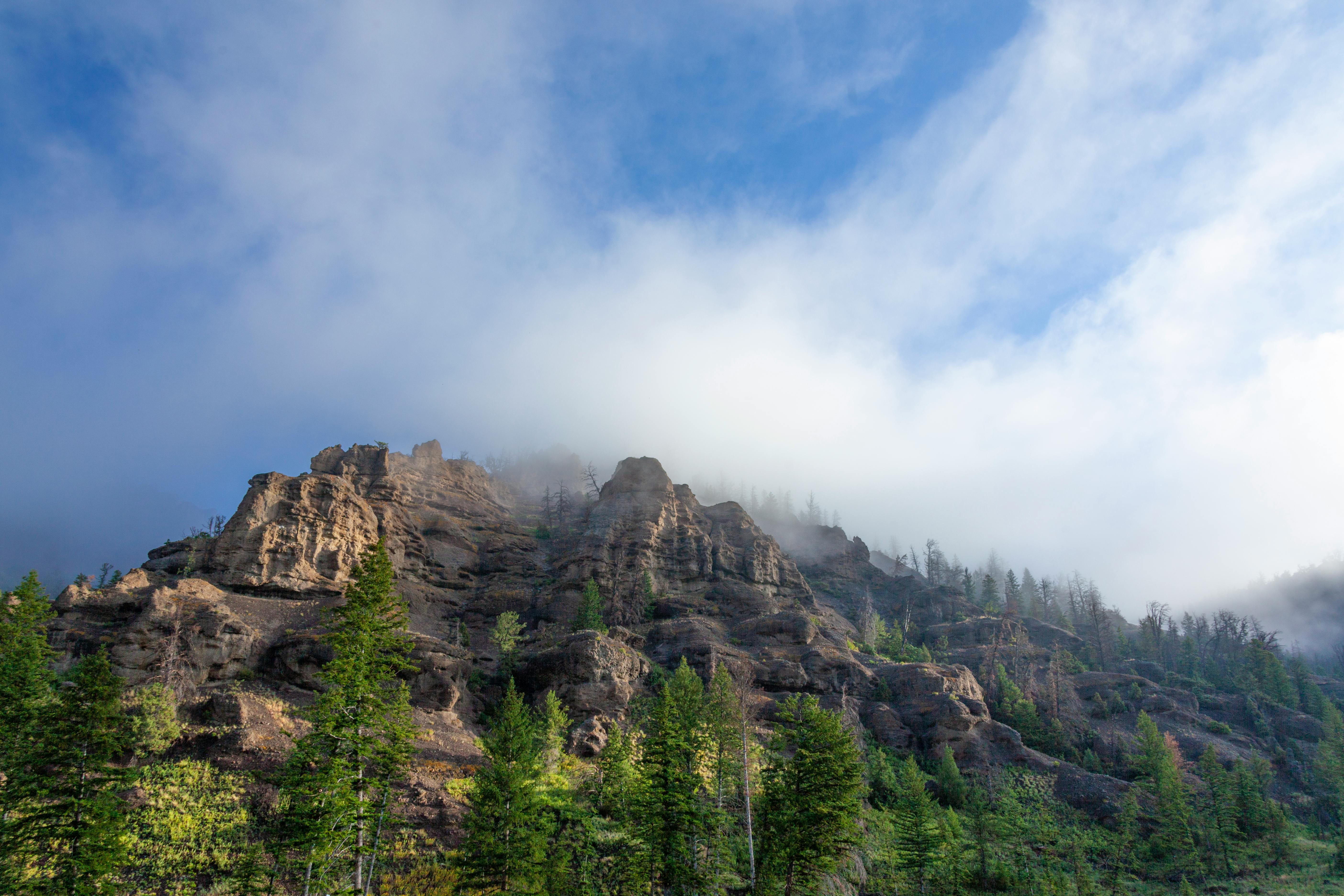 Rock Mountain Covered With Fog · Free Stock Photo