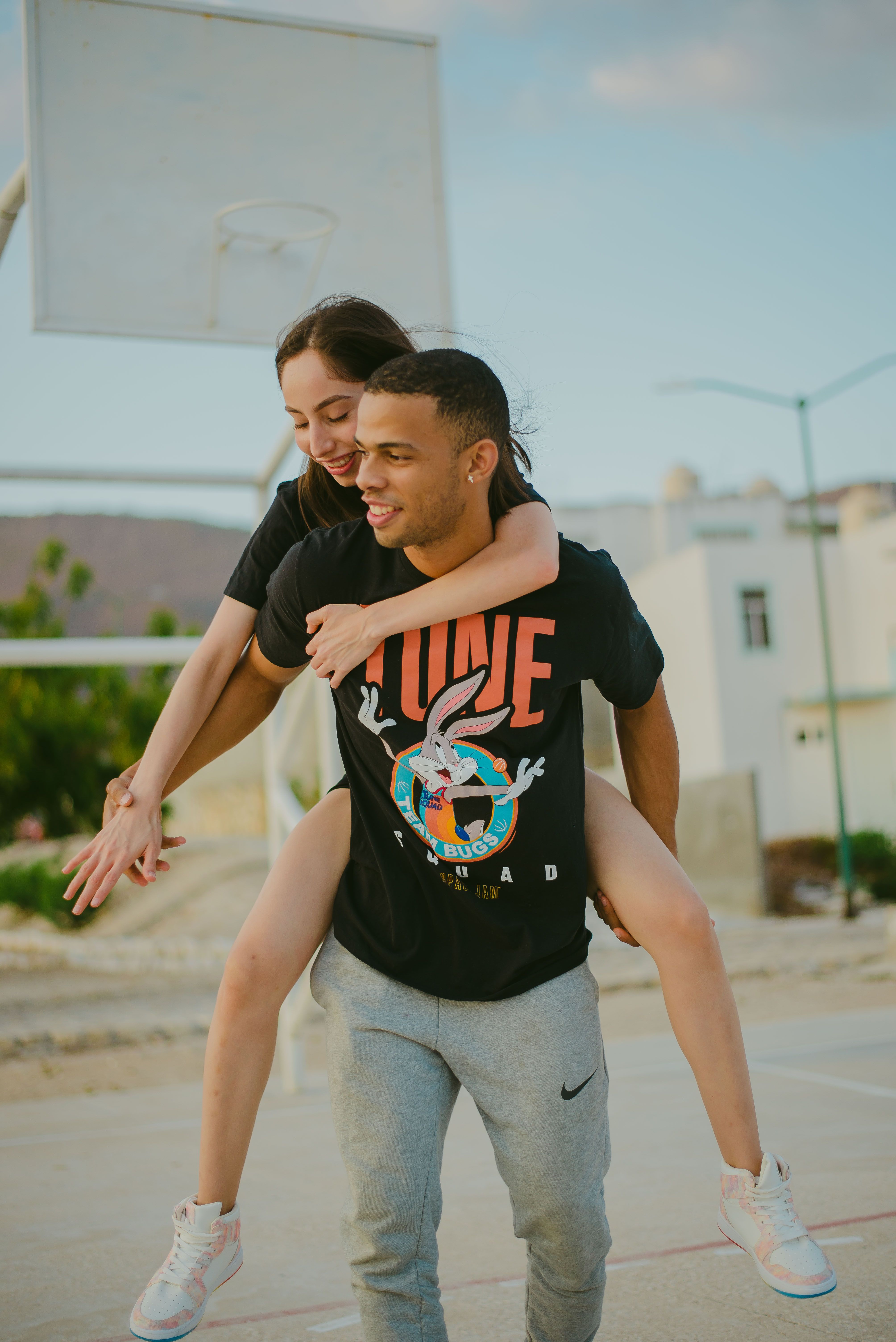 Man Carrying Piggyback Woman · Free Stock Photo