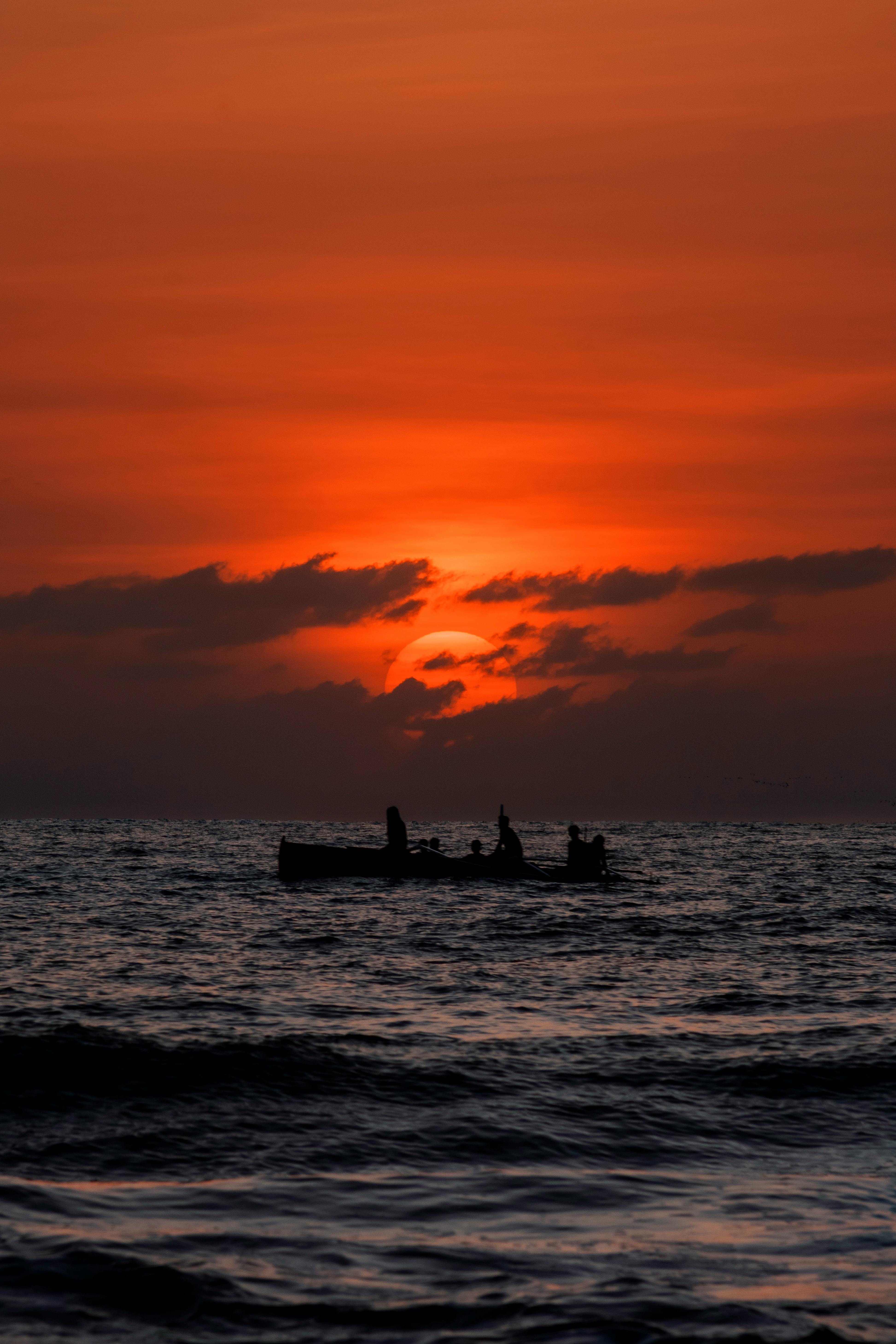 Red Sky over Boat at Sunset · Free Stock Photo