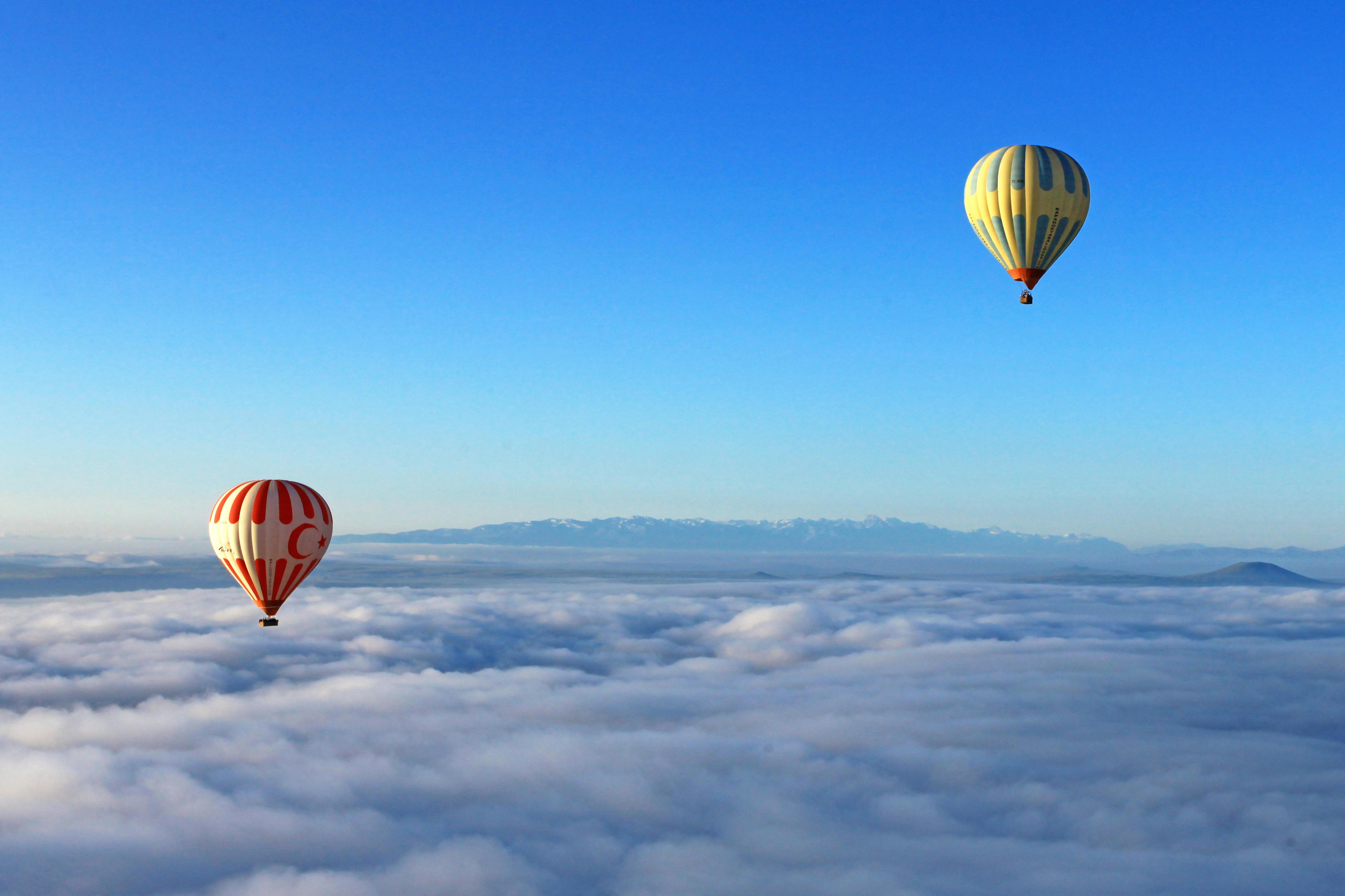 Photograph of Hot Air Balloons Above the Clouds · Free Stock Photo