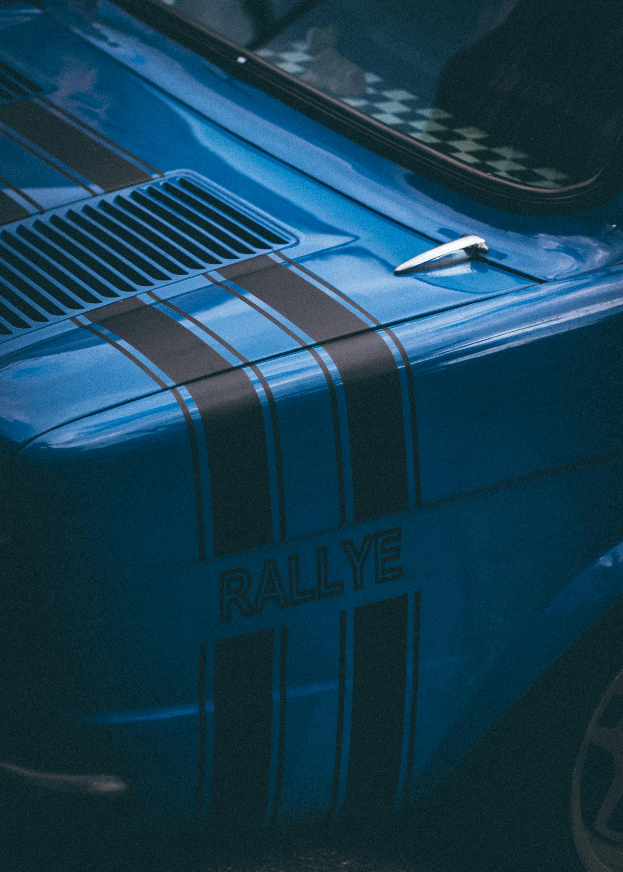 Black Stripes on Blue Car · Free Stock Photo