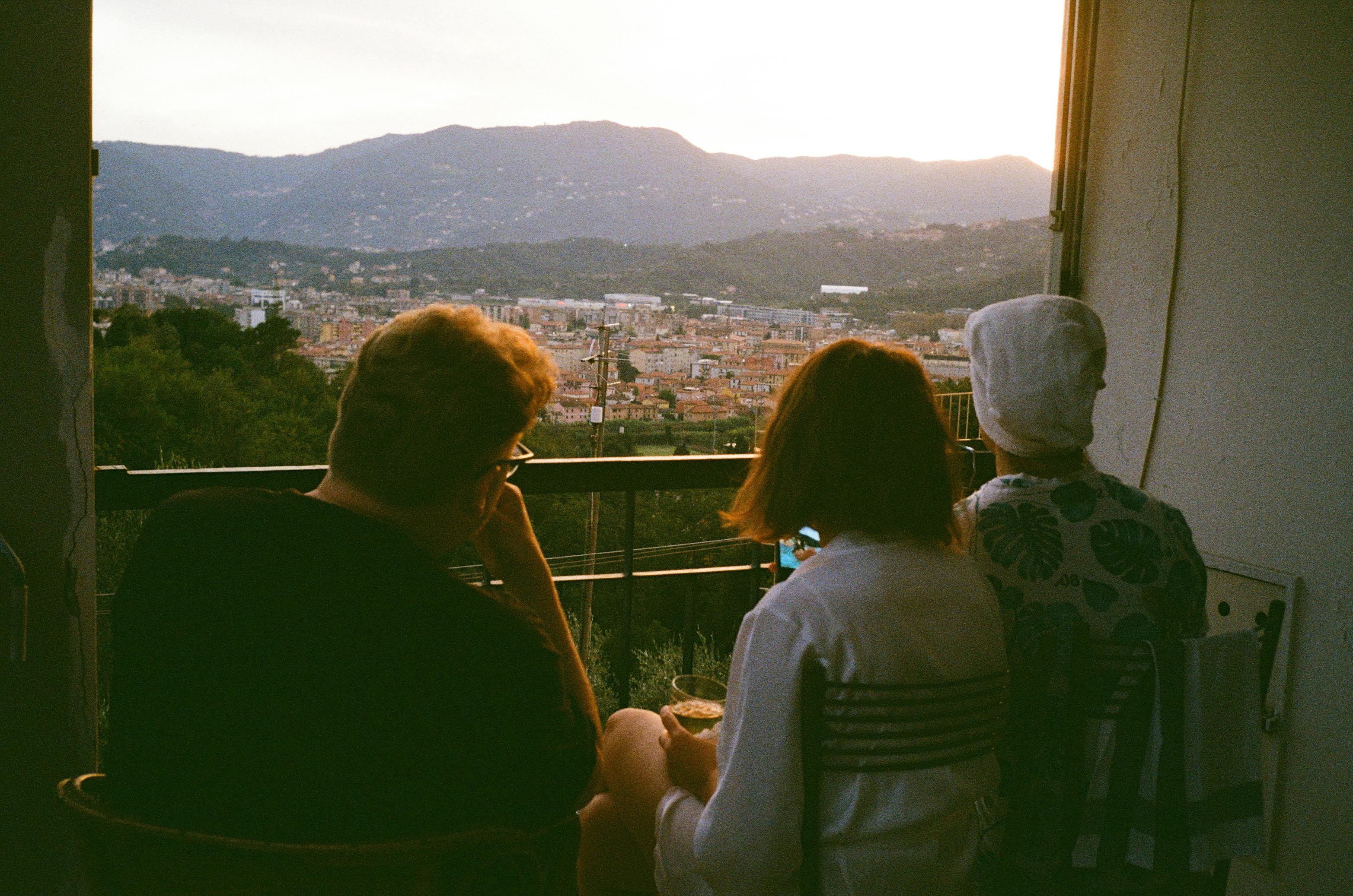 Photo of a Group of Friends on a Balcony · Free Stock Photo