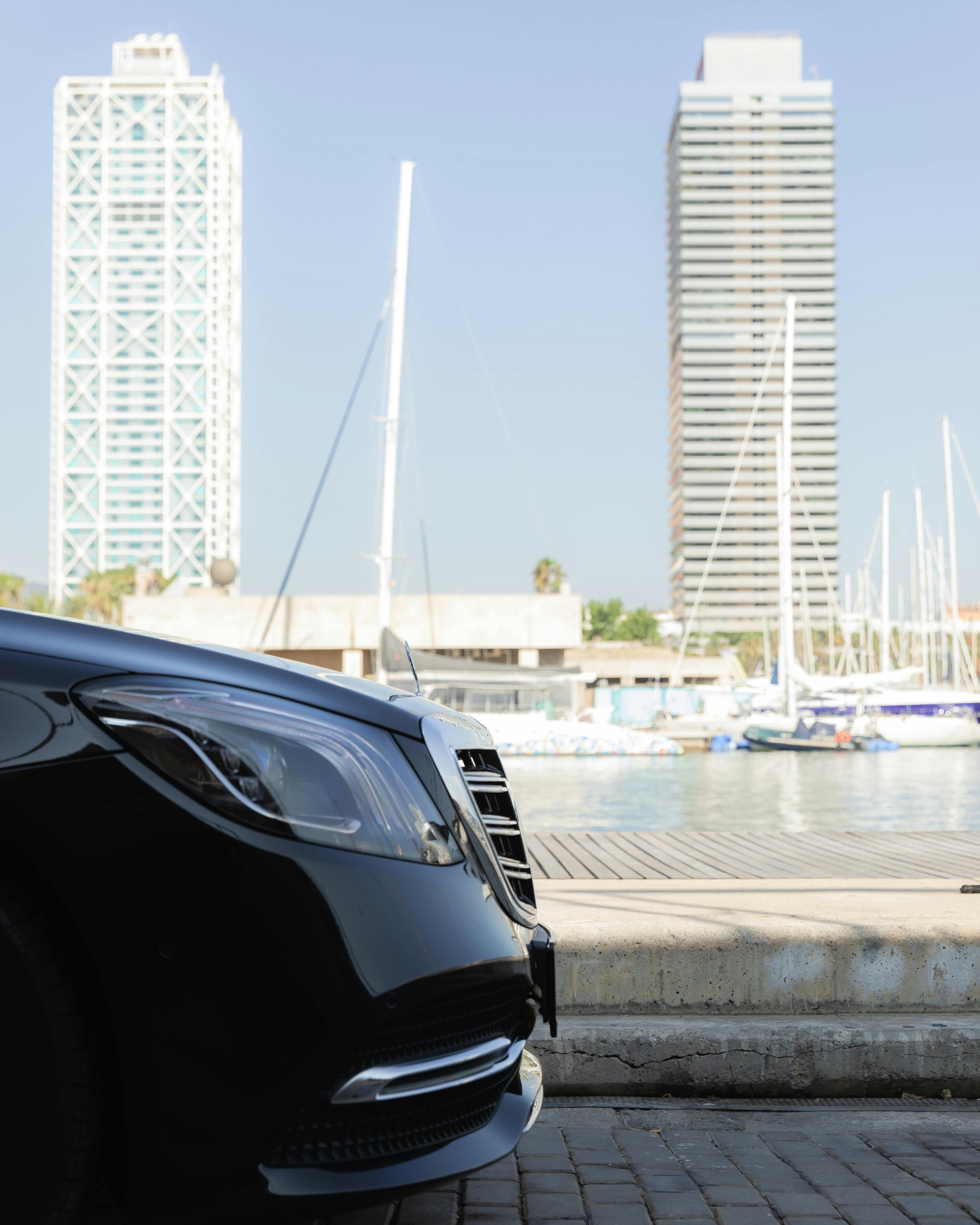 Black Mercedes Car with Skyscrapers in the Background · Free Stock Photo