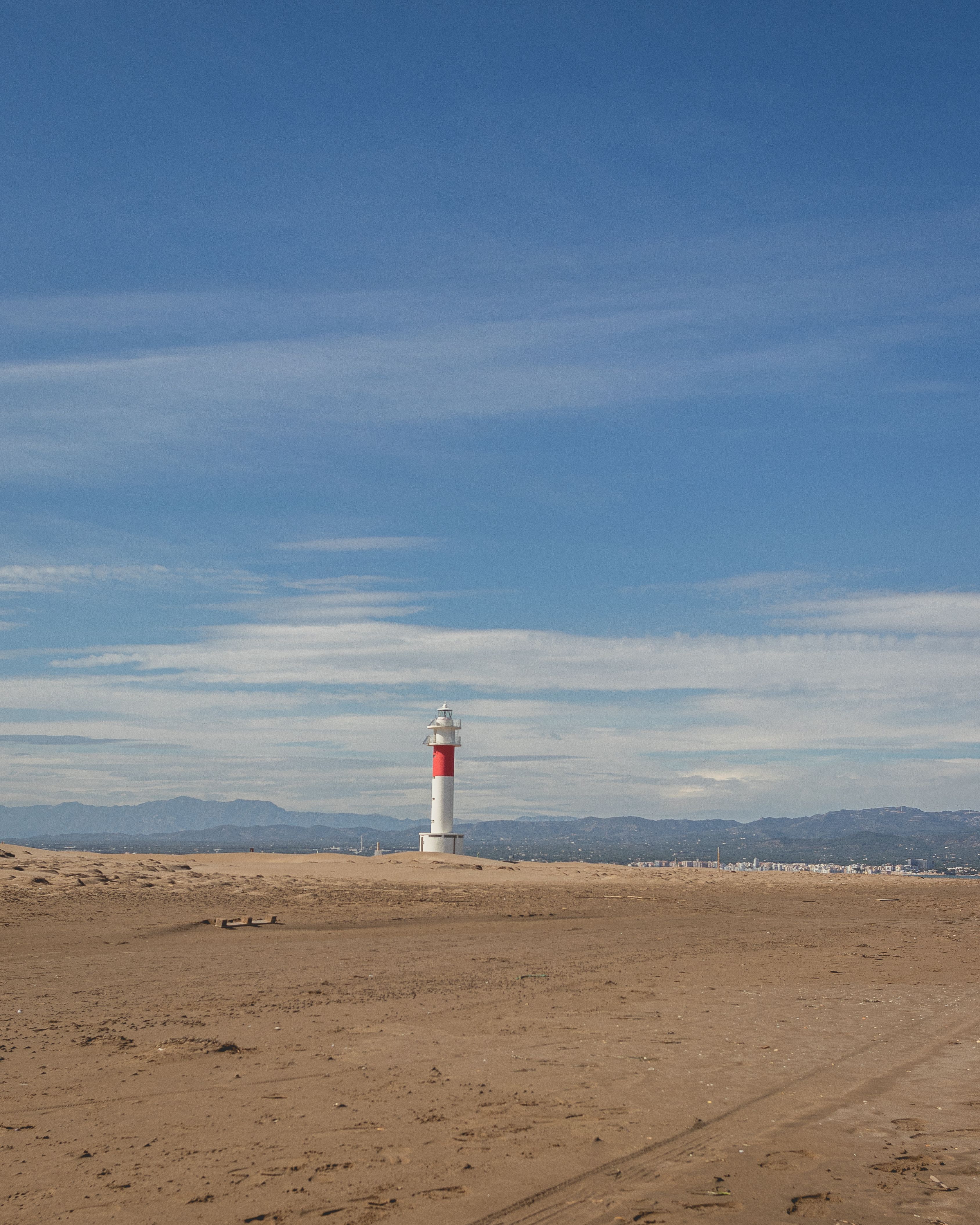 A White Concrete Lighthouse · Free Stock Photo