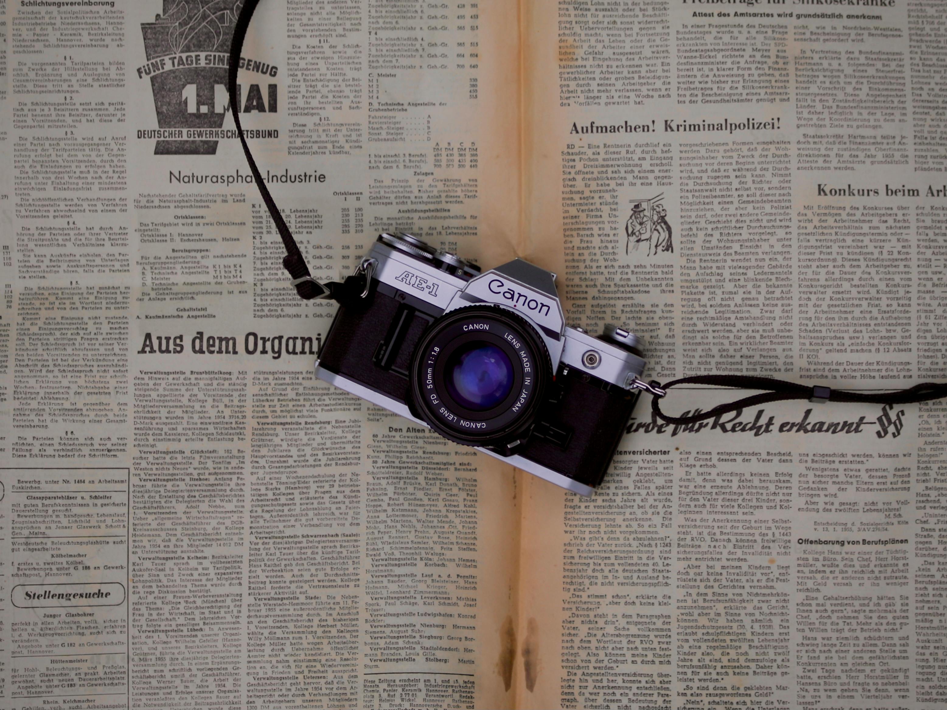 Black and Silver Camera on Newspaper · Free Stock Photo