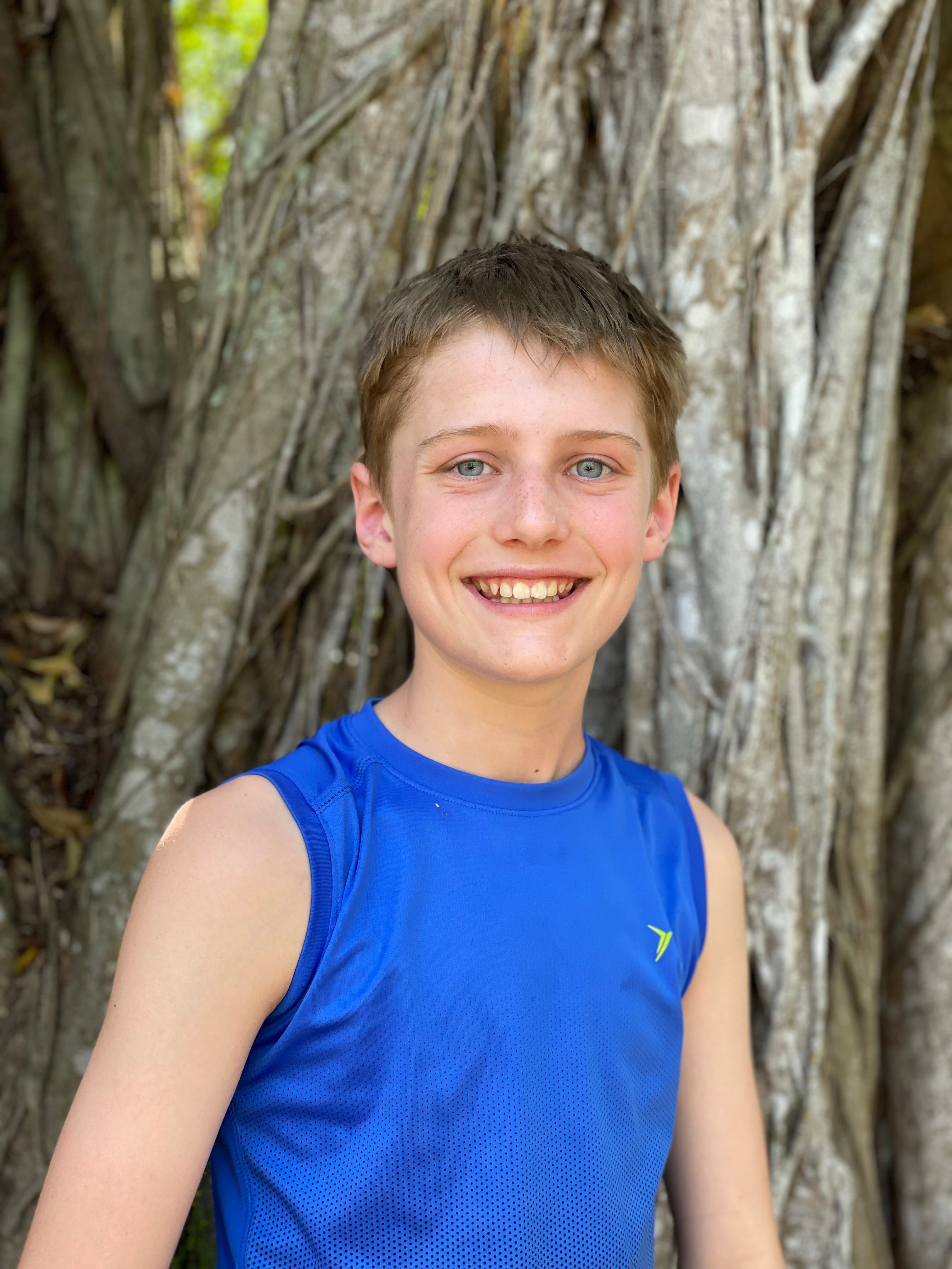 A Boy in Blue Tank Top Smiling · Free Stock Photo