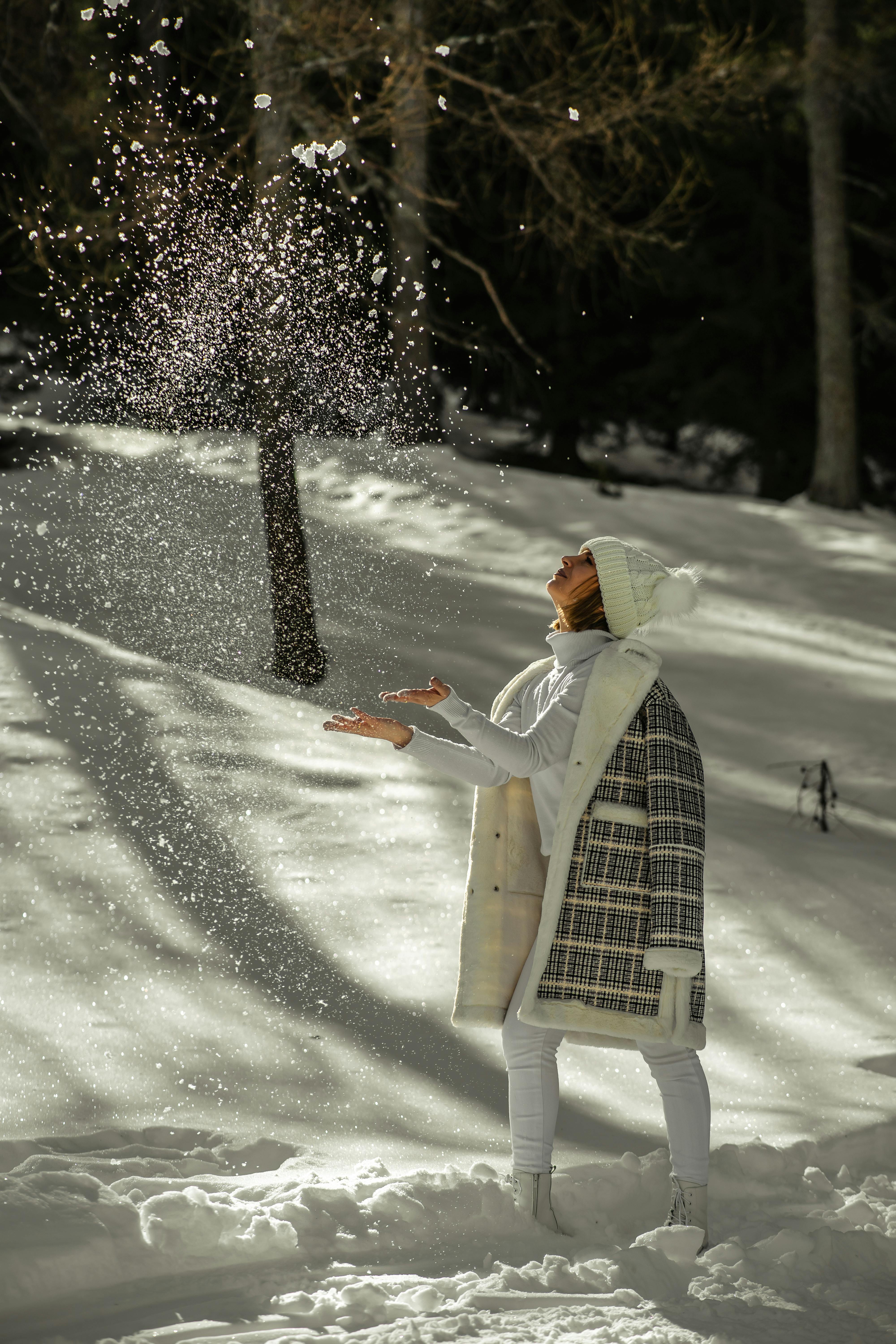 Woman Throwing Snow in the Air · Free Stock Photo
