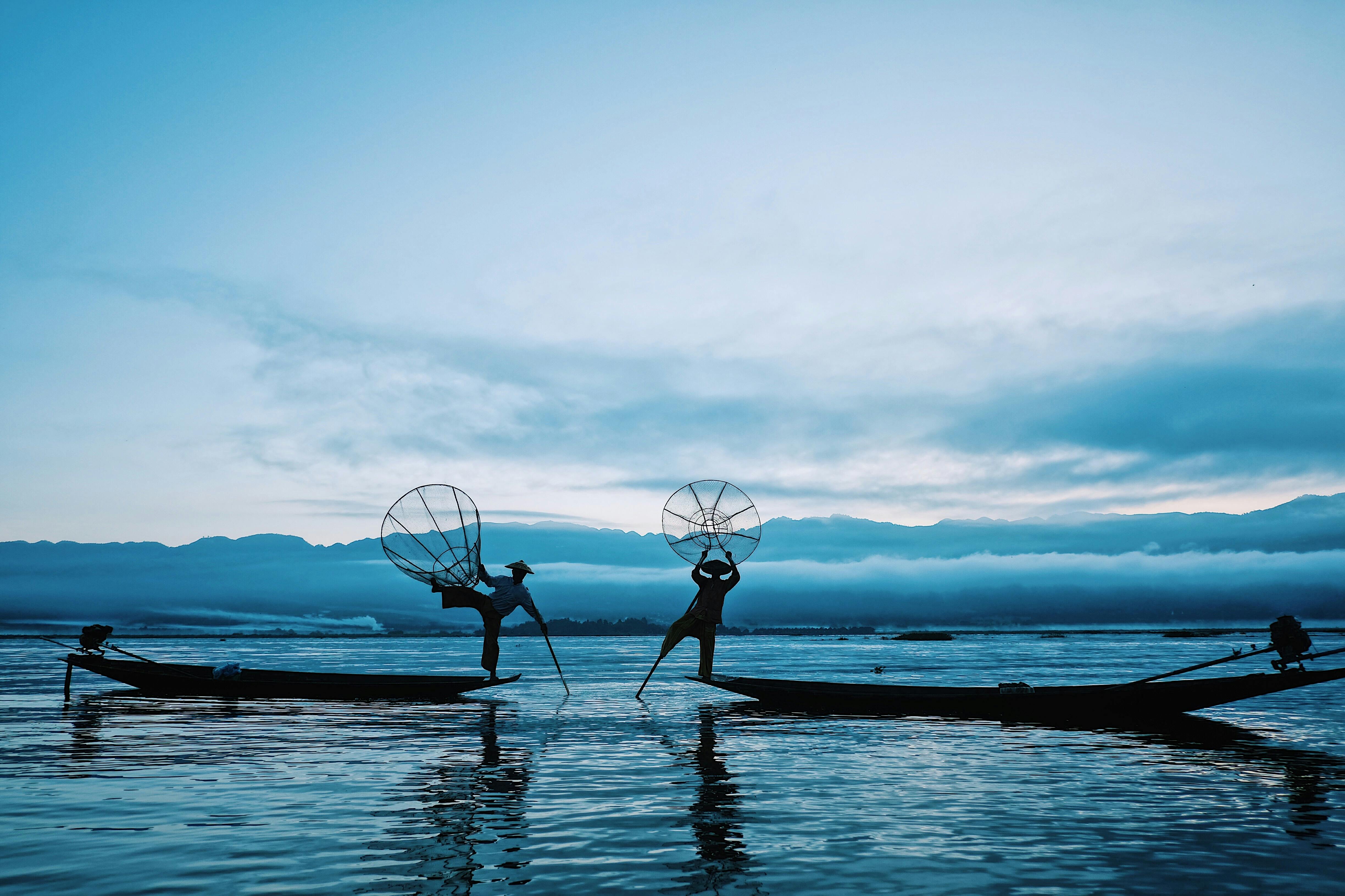 Shirtless Man Pulling Fishing Net · Free Stock Photo