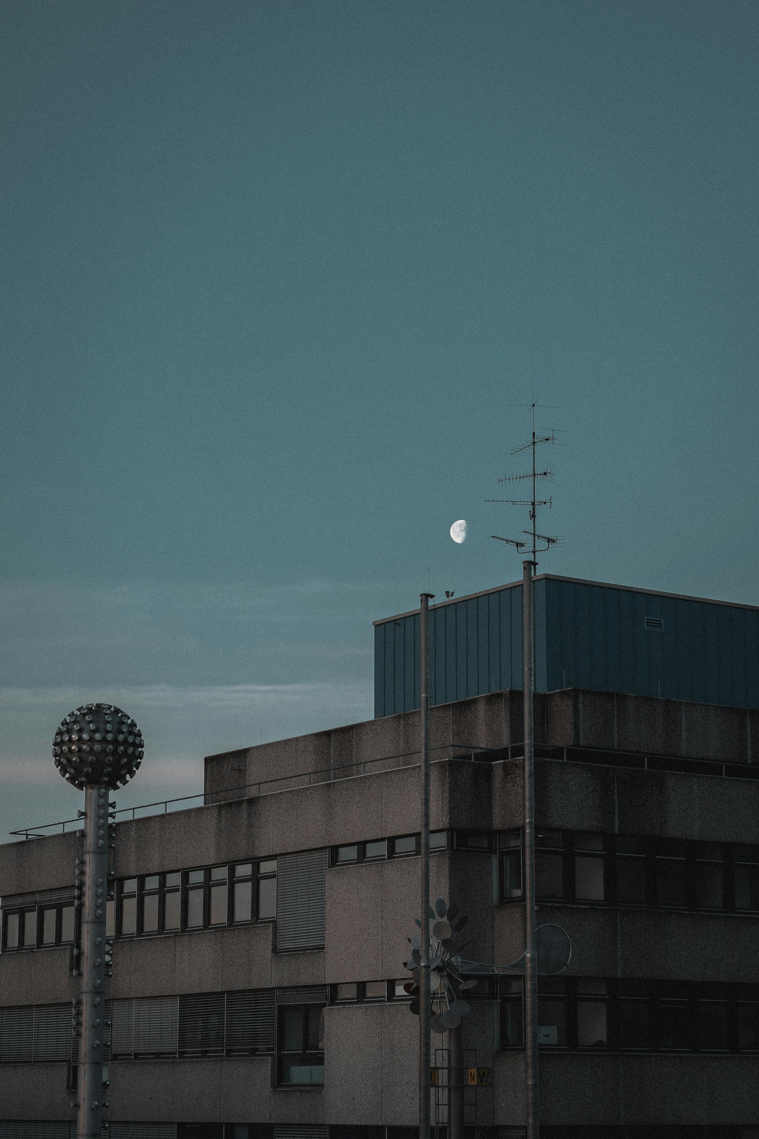 Moon in Sky above City Building · Free Stock Photo
