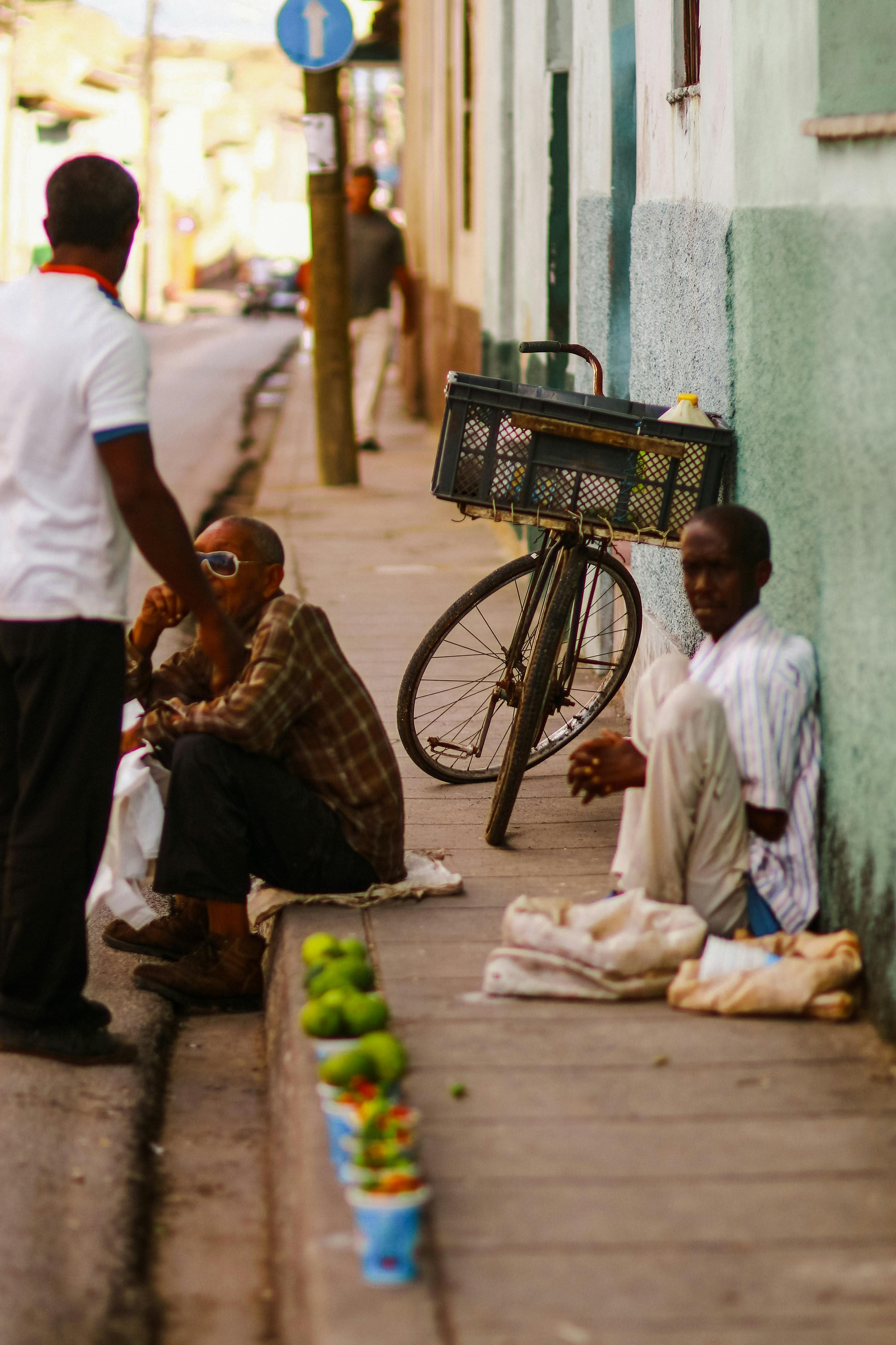 Street Vendor and Men on Street · Free Stock Photo
