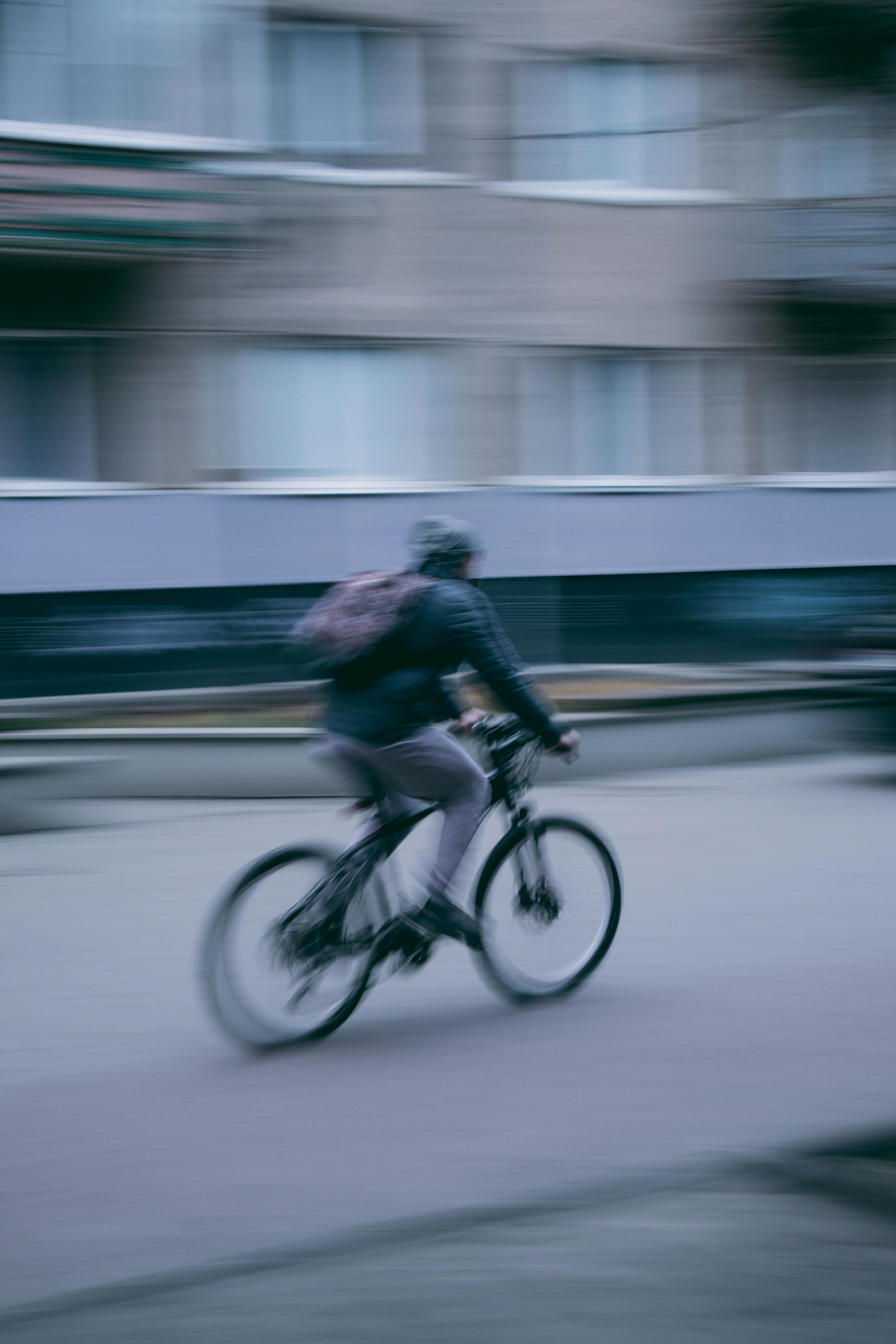 Man Riding a Bike in Motion · Free Stock Photo