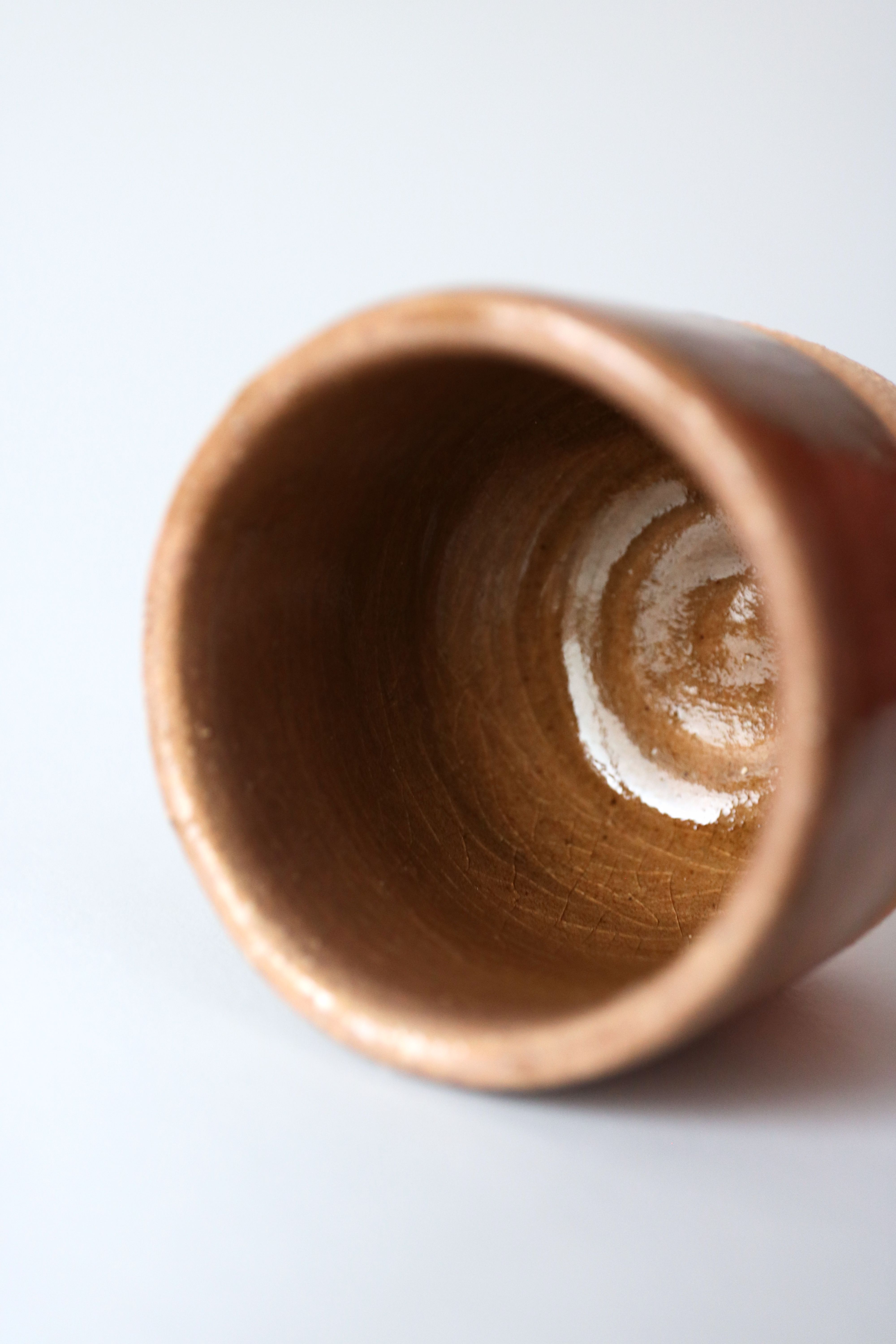 A Brown Ceramic Cup in Close-Up Photography · Free Stock Photo
