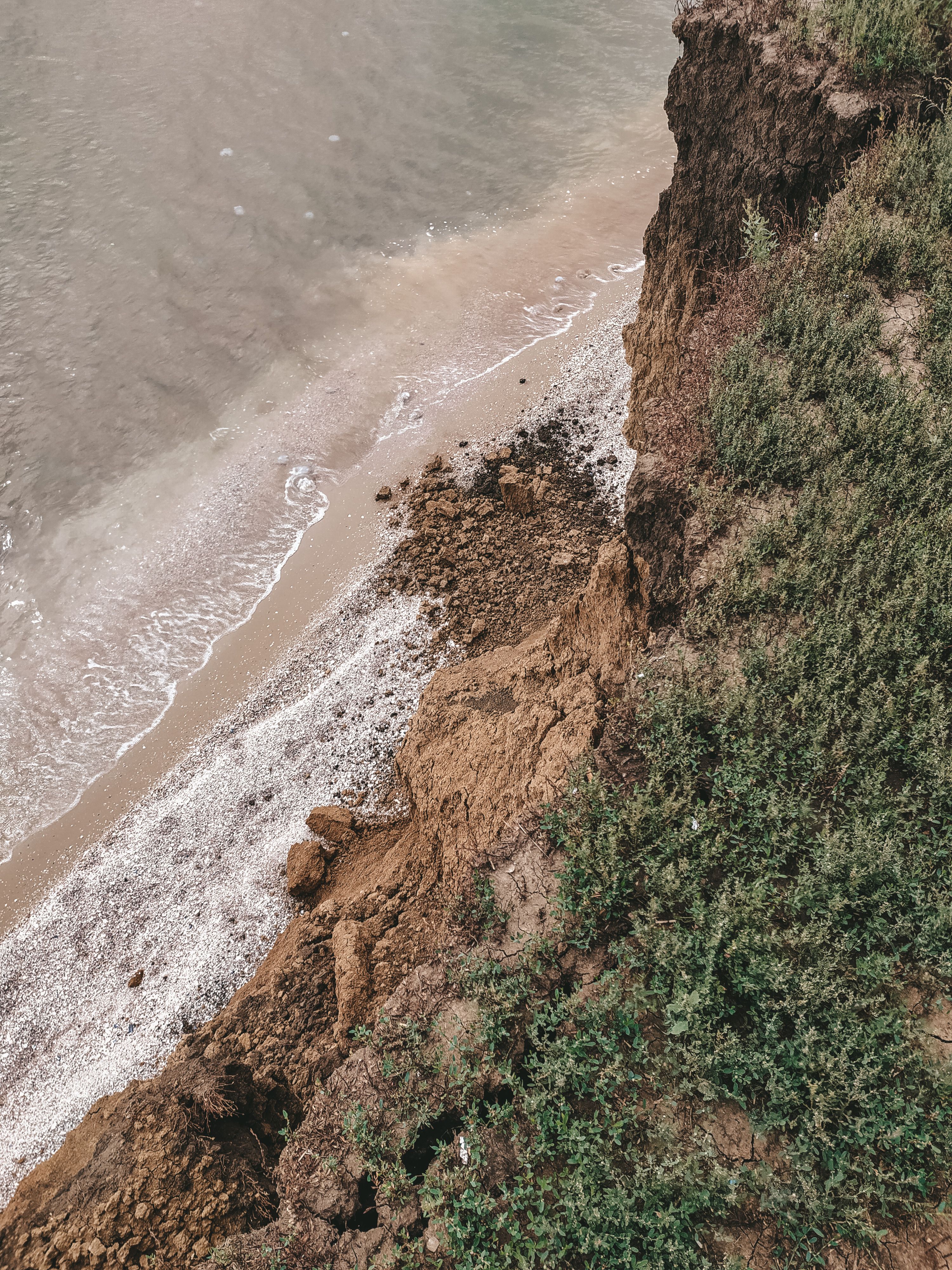 Photo of a Cliff Near a Seashore · Free Stock Photo