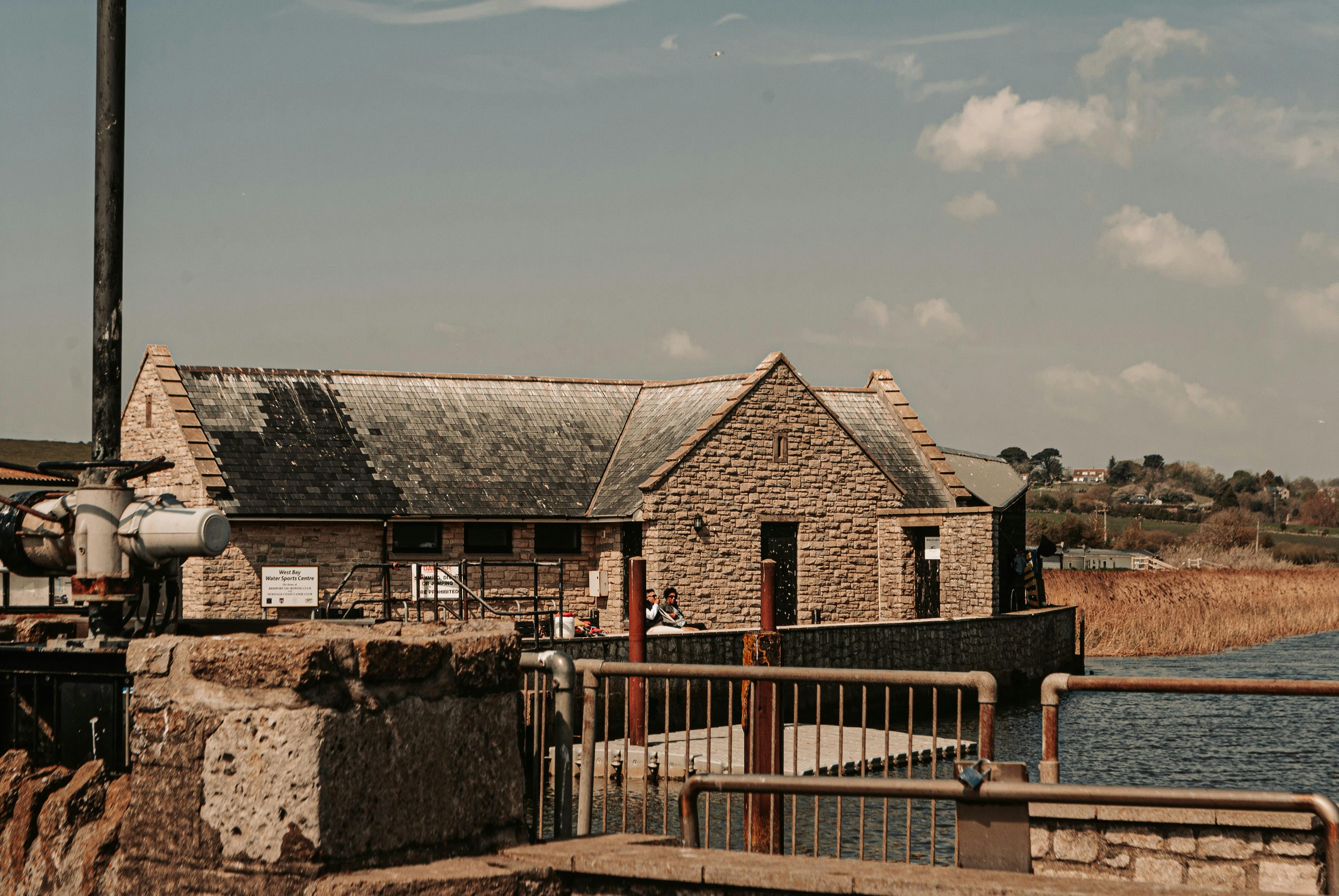 Old Building by River · Free Stock Photo
