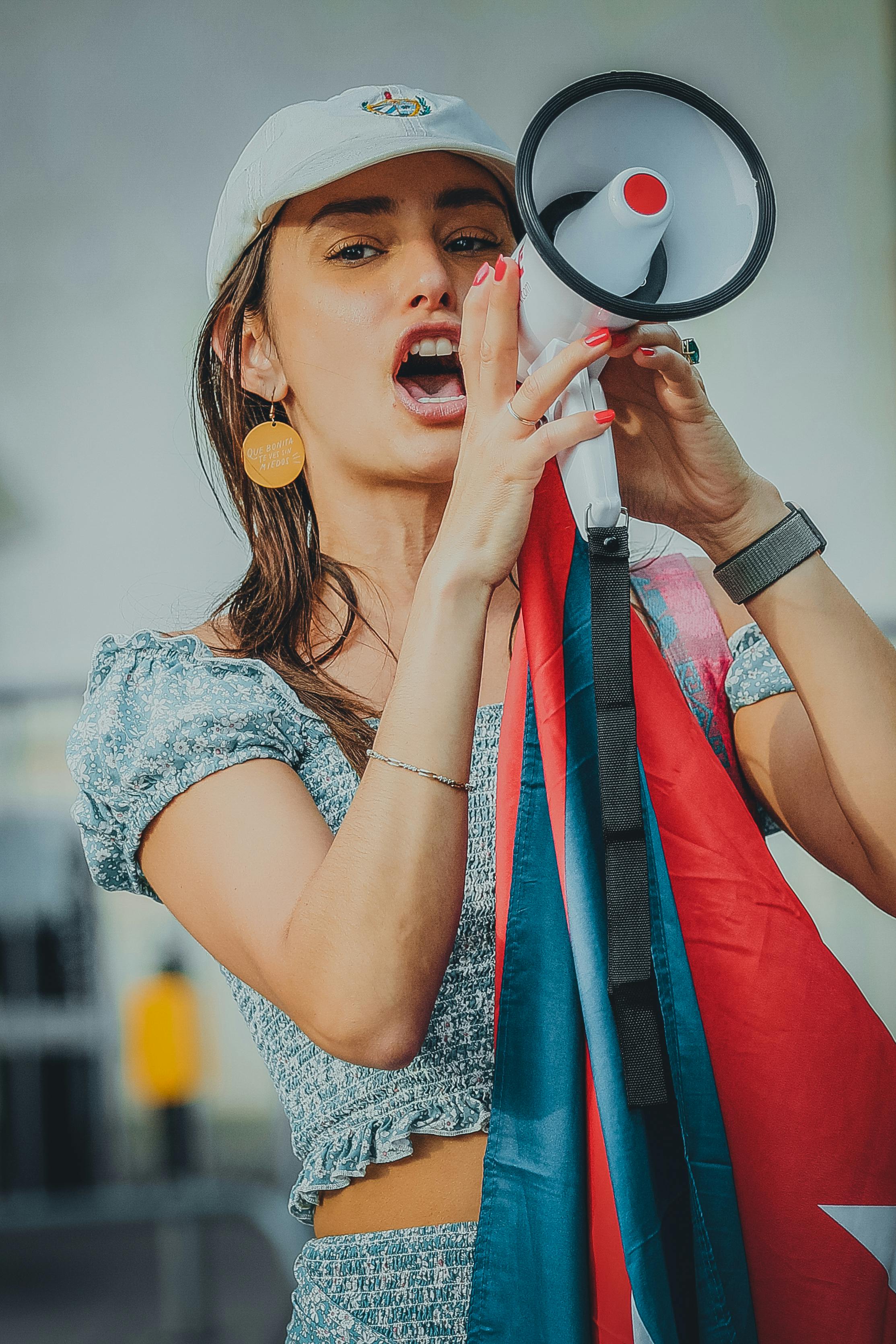 A Woman Using a Megaphone · Free Stock Photo