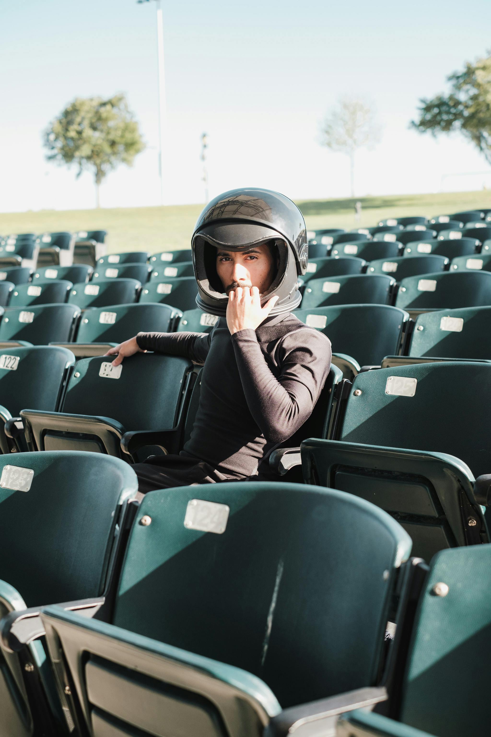 Man Sitting on Seats in Sunlight · Free Stock Photo