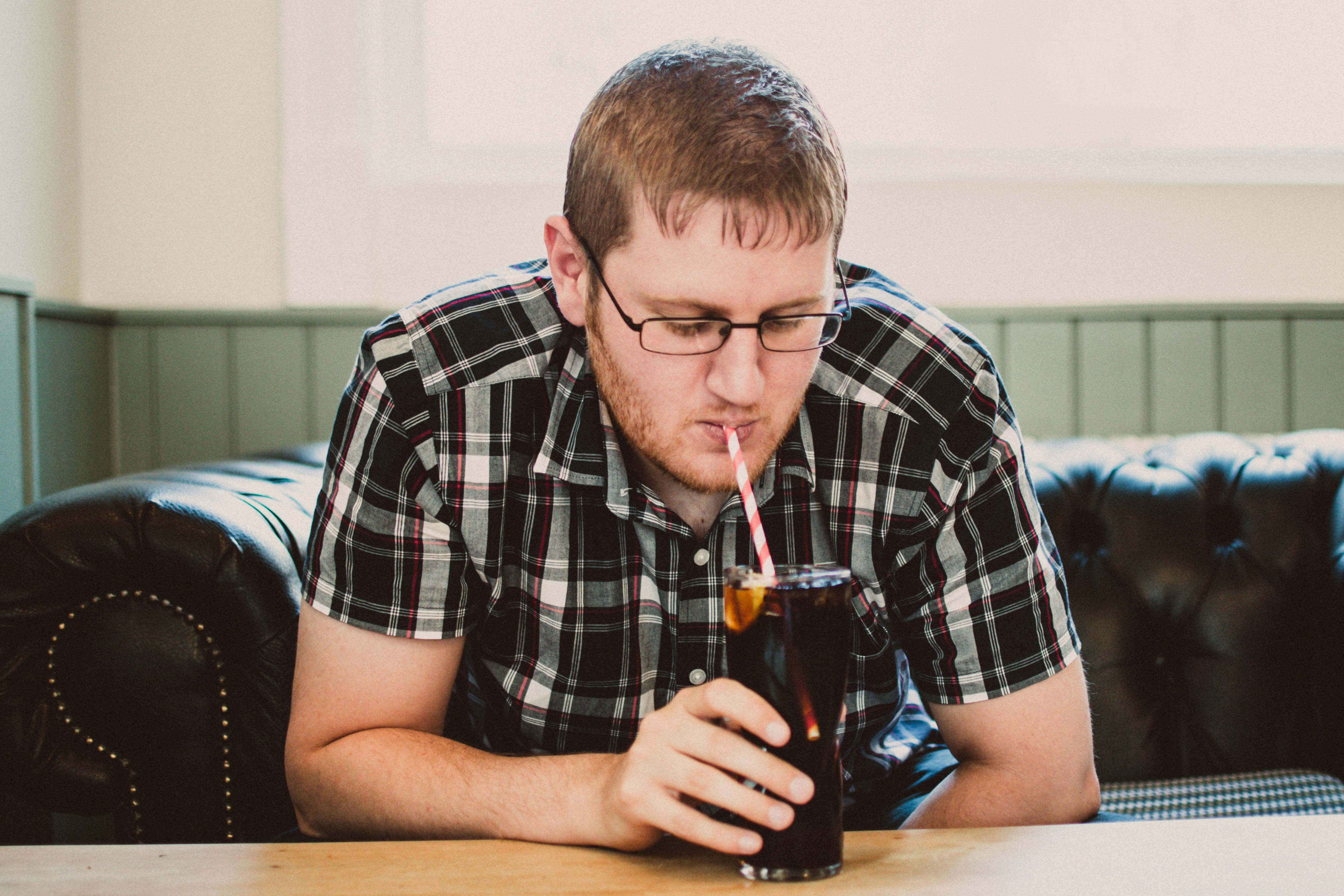 A Woman Drinking From a Mug · Free Stock Photo