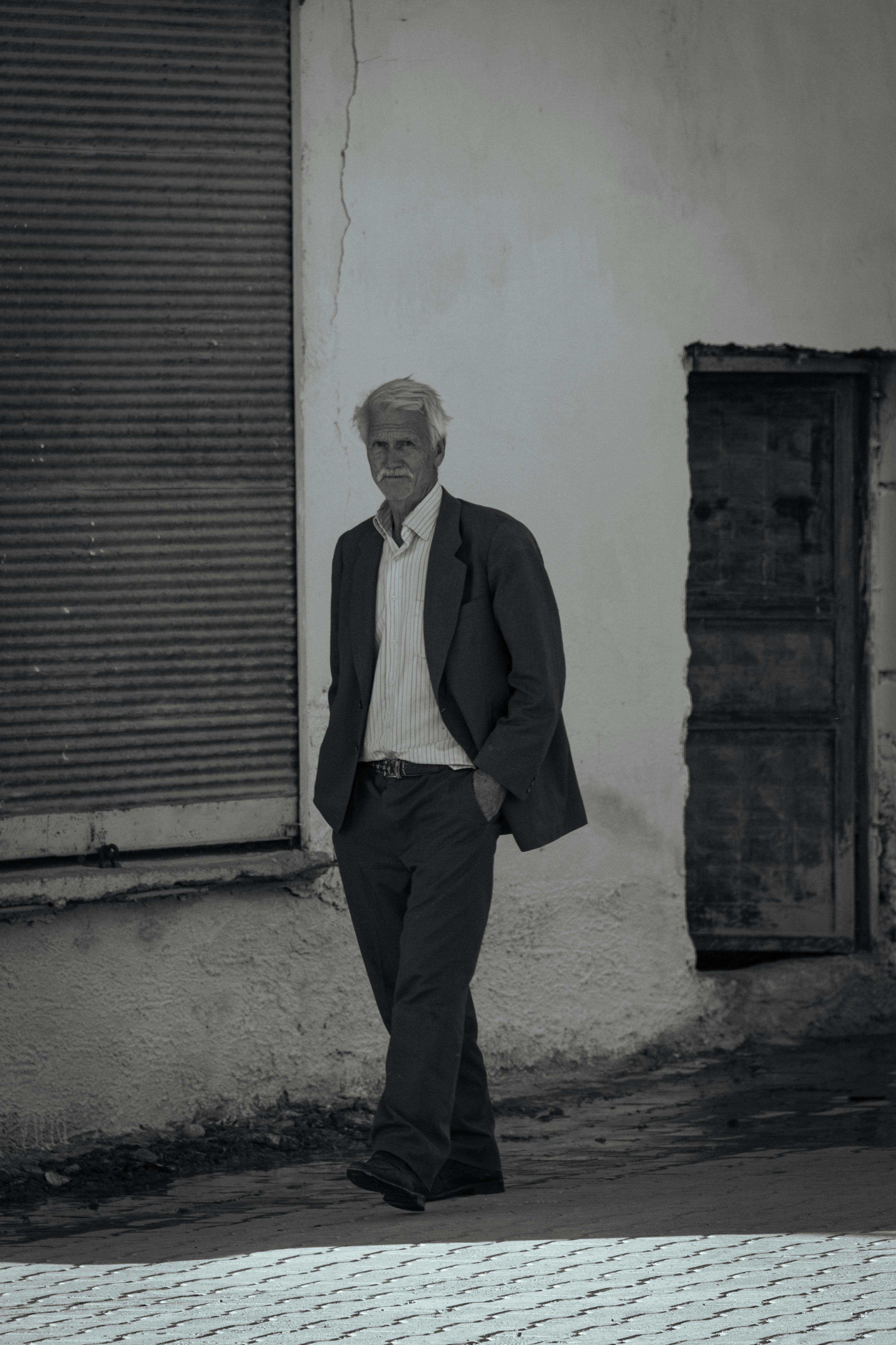 Grayscale Photo of a Man Posing · Free Stock Photo