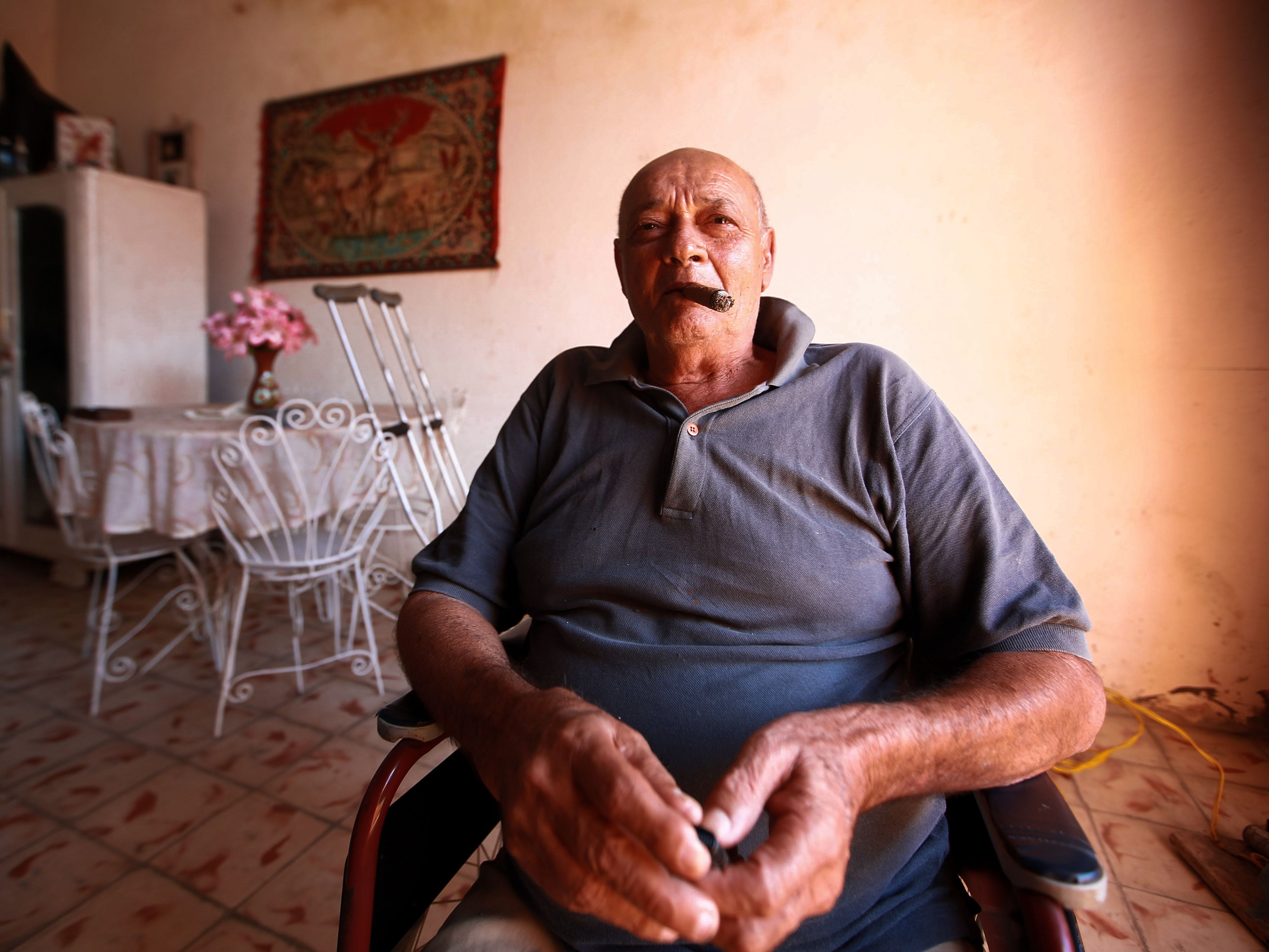 A Man in Blue Polo Shirt Sitting on the Wheelchair · Free Stock Photo