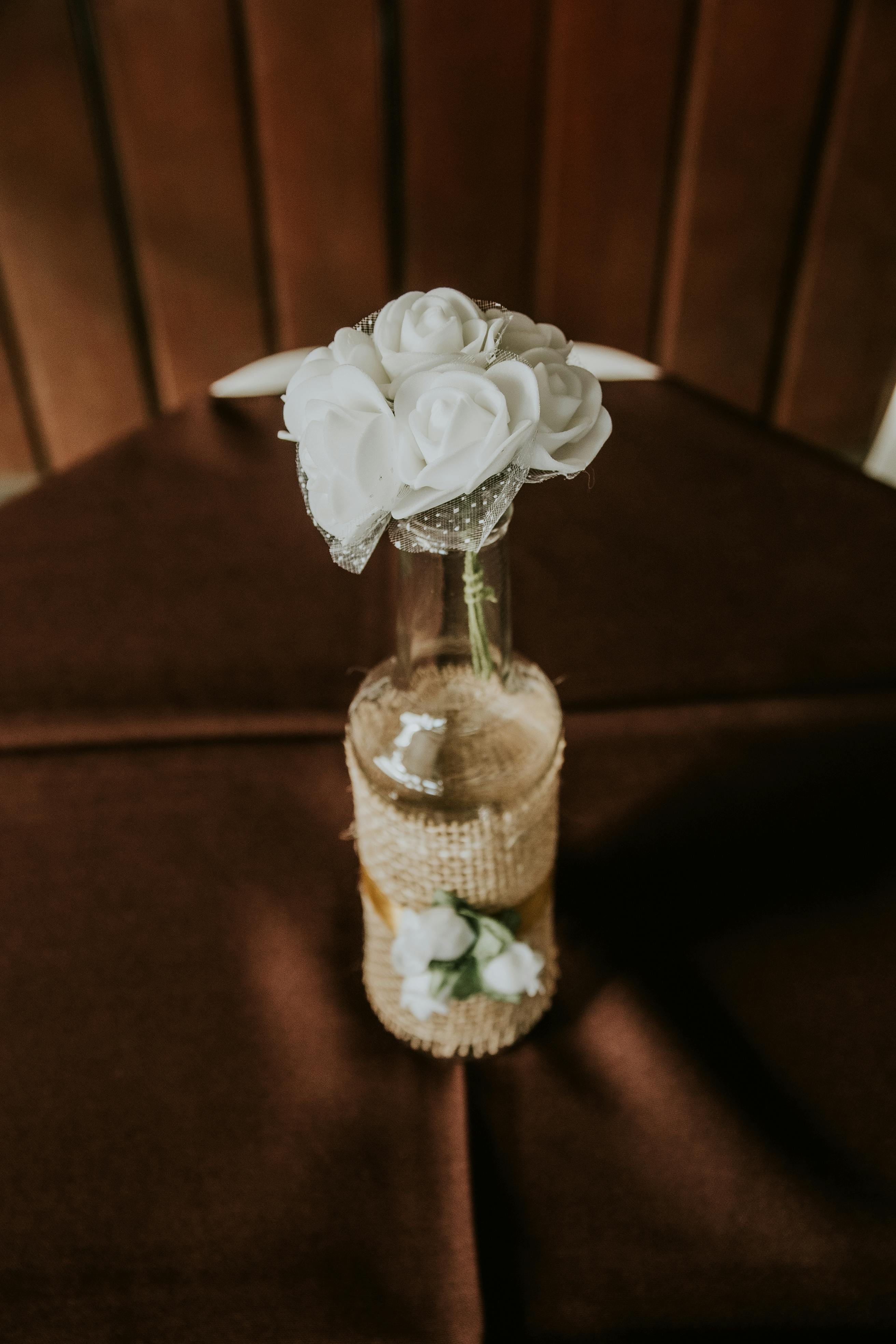 White Flower in Clear Glass Bottle · Free Stock Photo