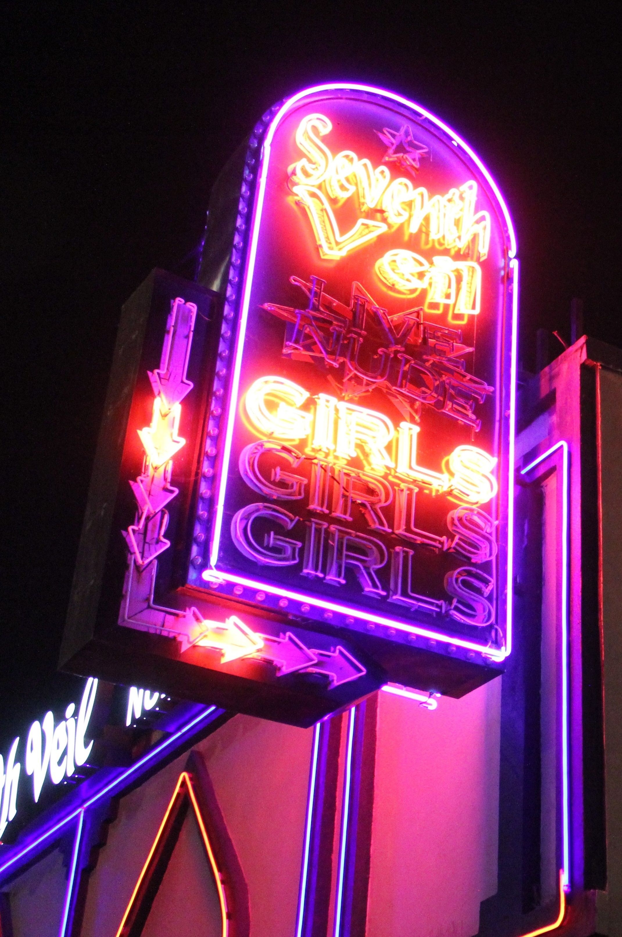 Photo of a Purple and Yellow Neon Signage · Free Stock Photo