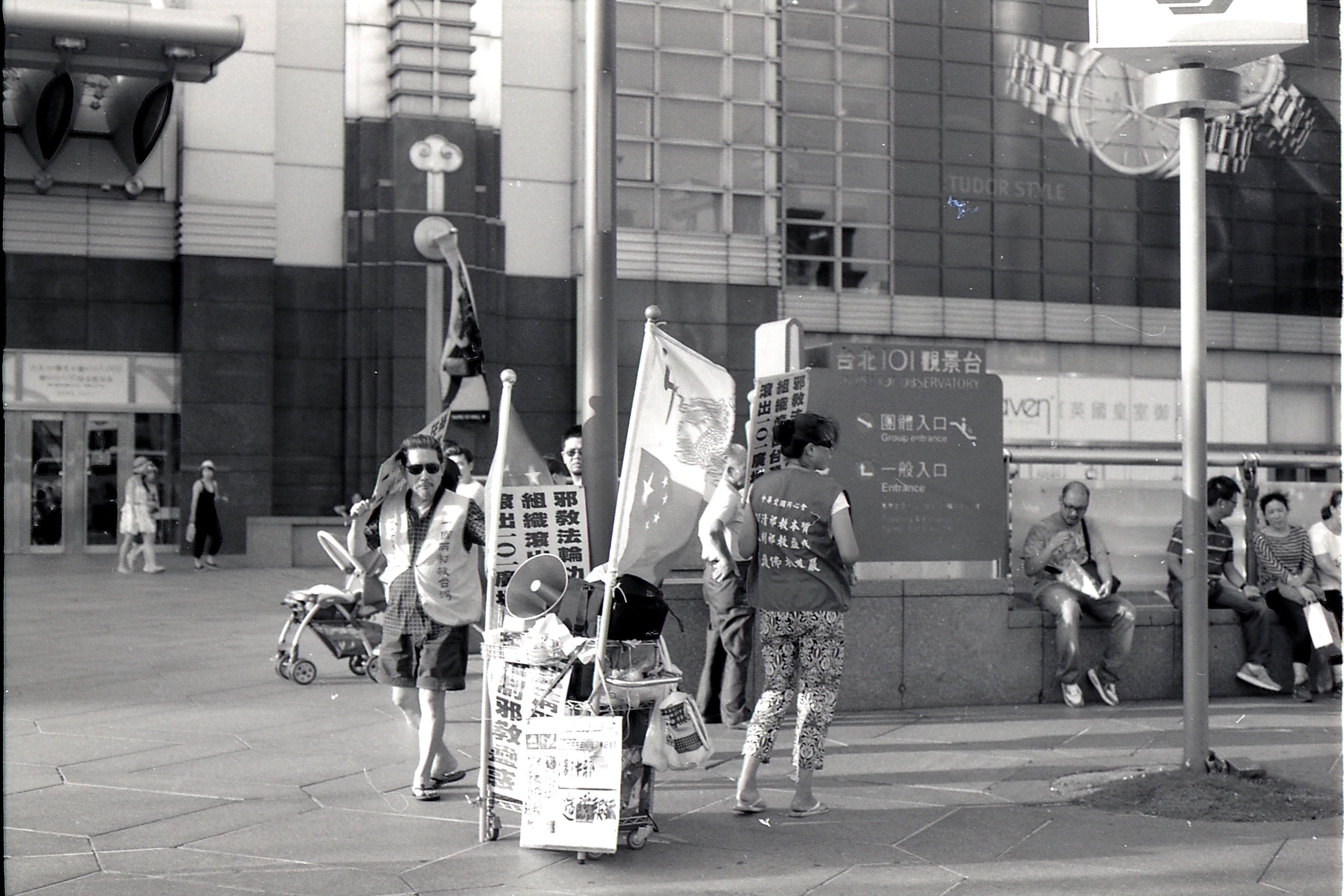 People Holding Posters While Walking on the Street · Free Stock Photo