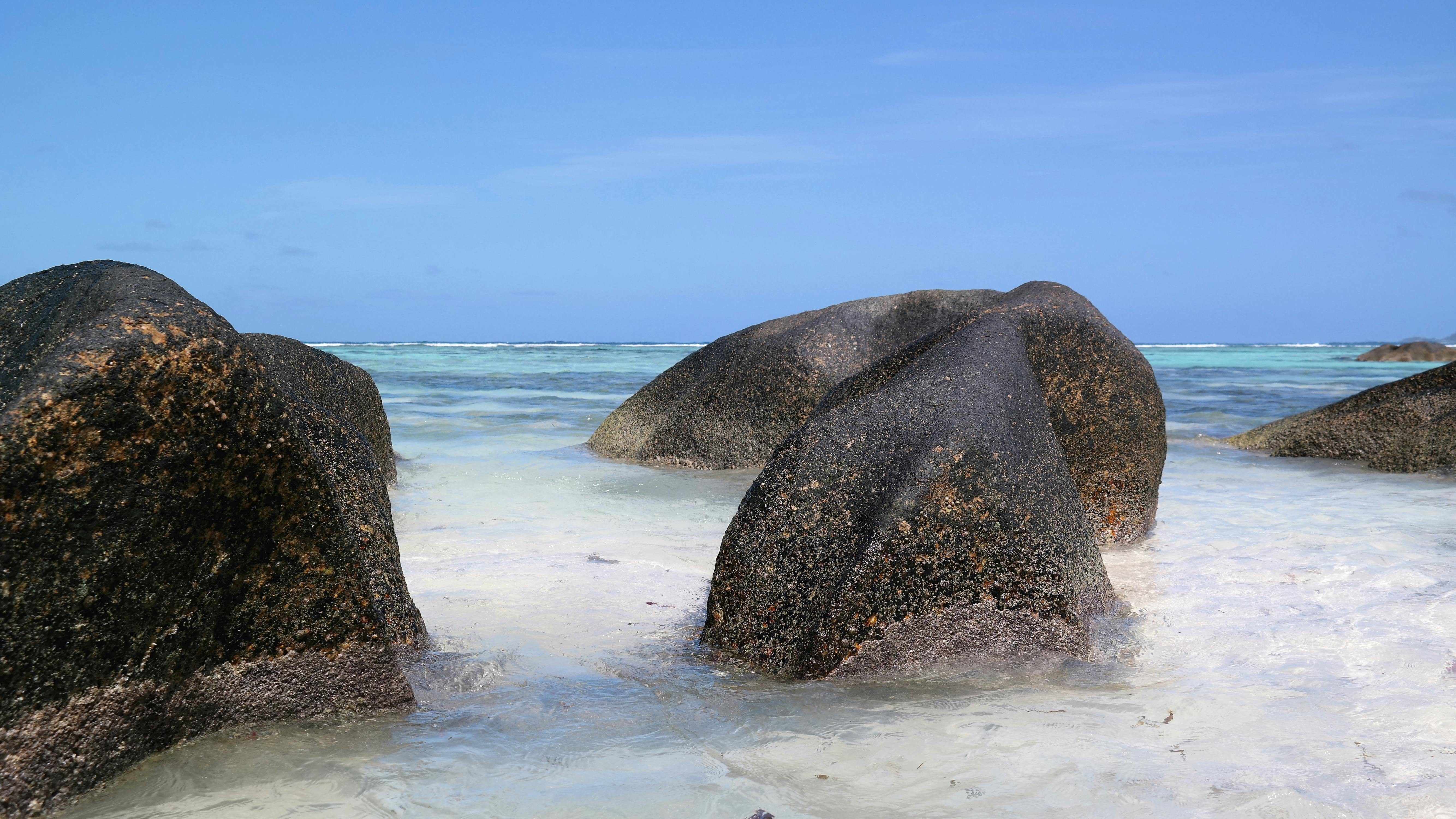 Photograph of Boulders at a Beach · Free Stock Photo