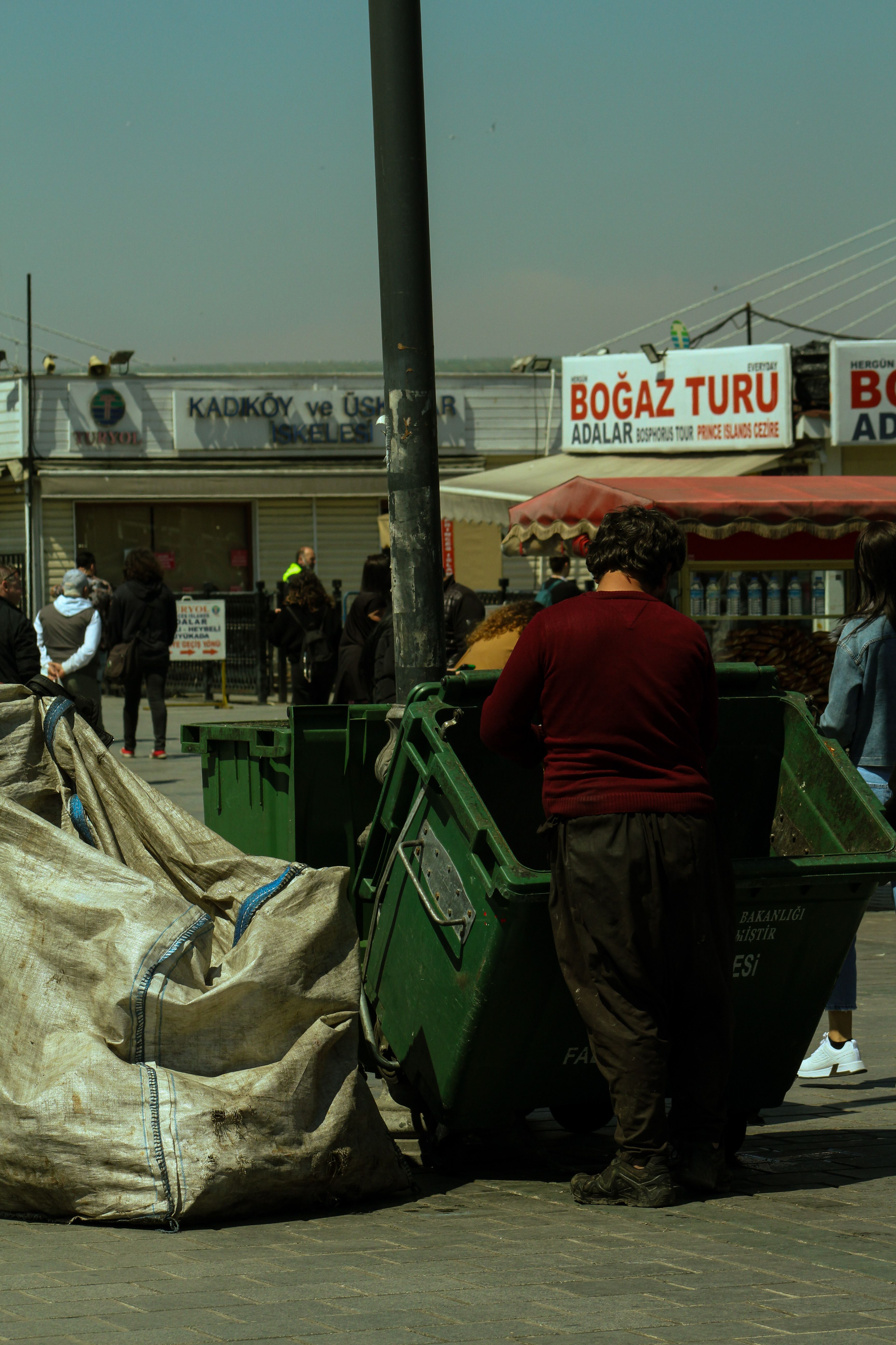 Man Throwing Thrash into a Bin · Free Stock Photo