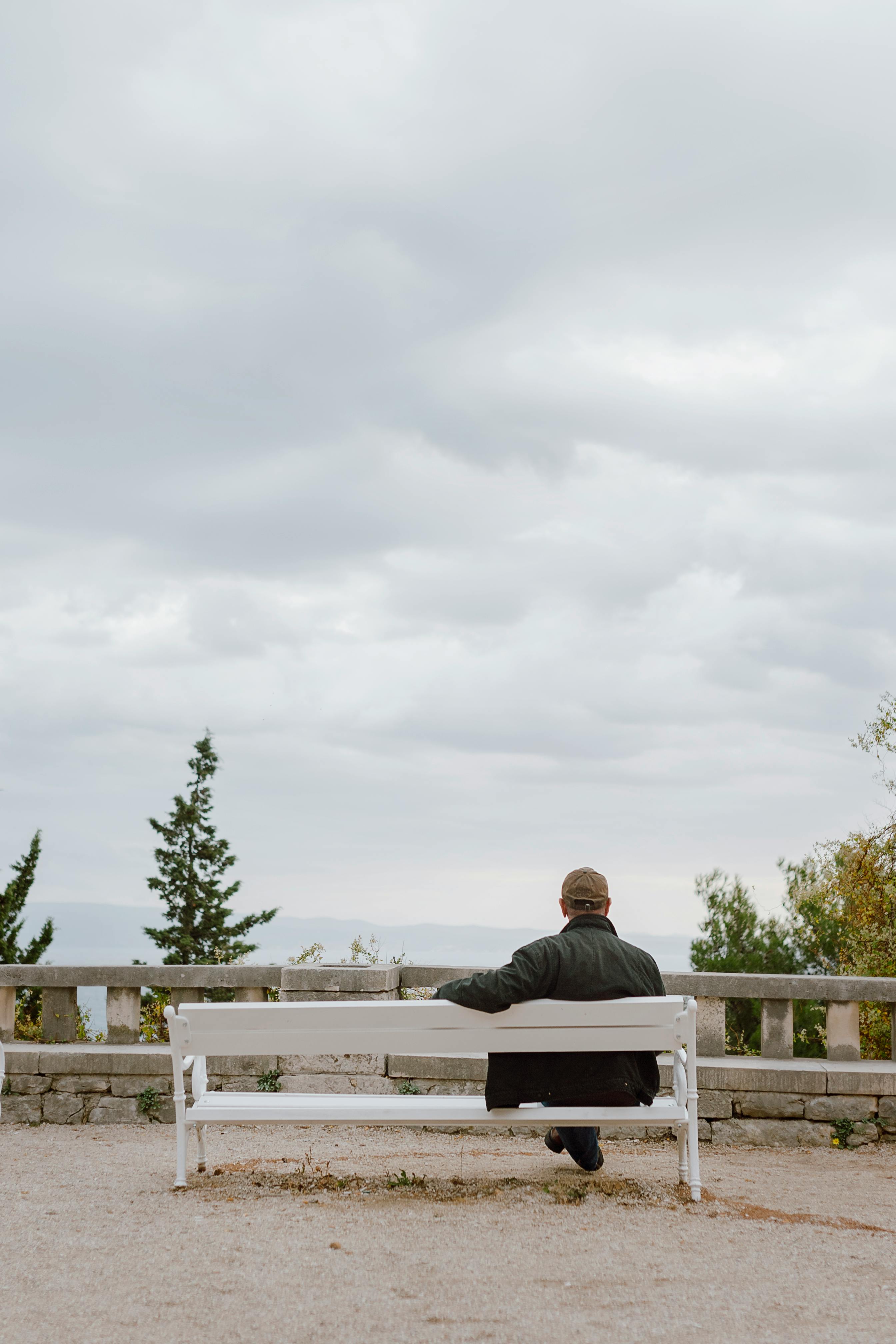 Man Sitting on Bench · Free Stock Photo