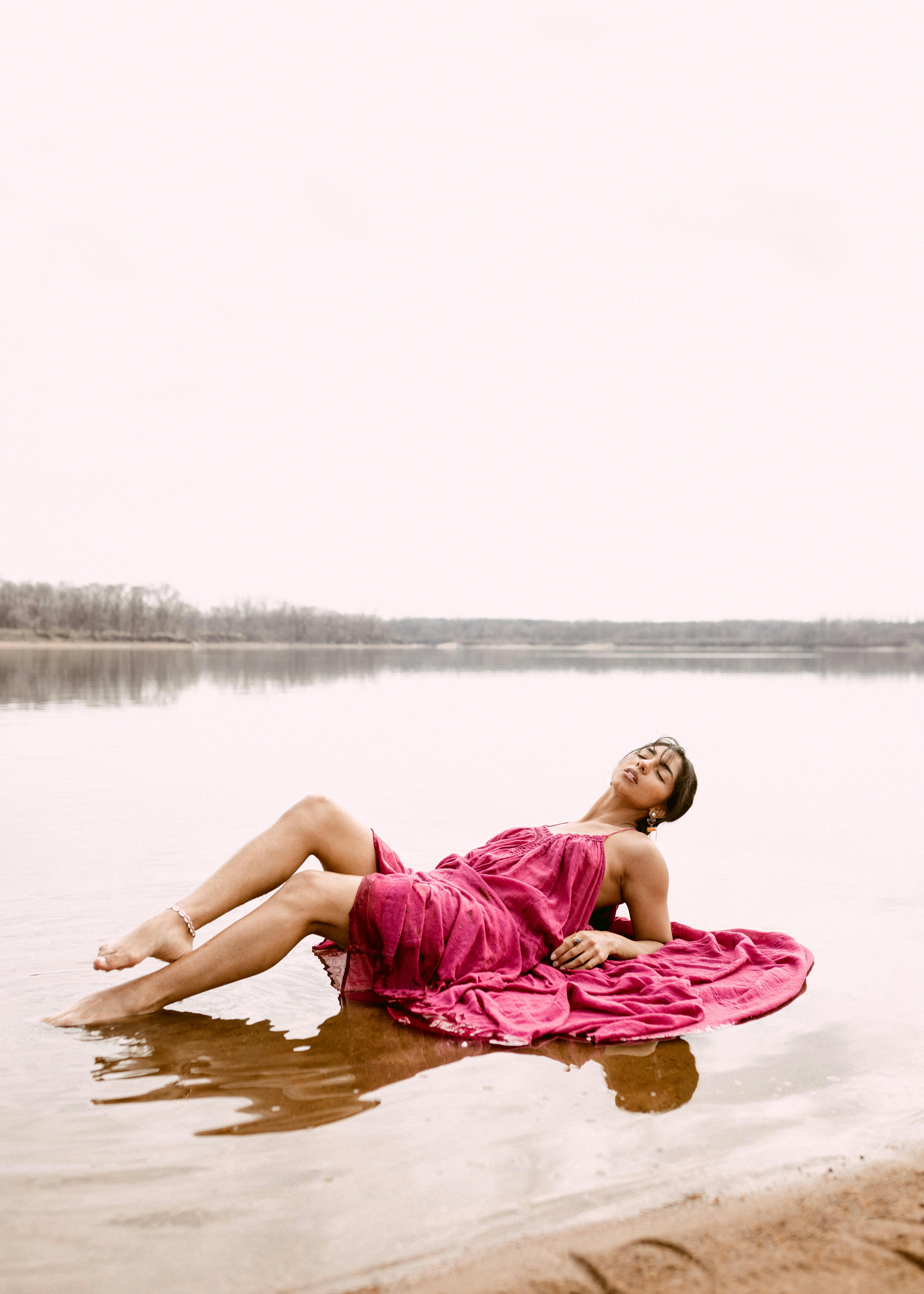 Woman in Pink Dress Lying in Sea · Free Stock Photo