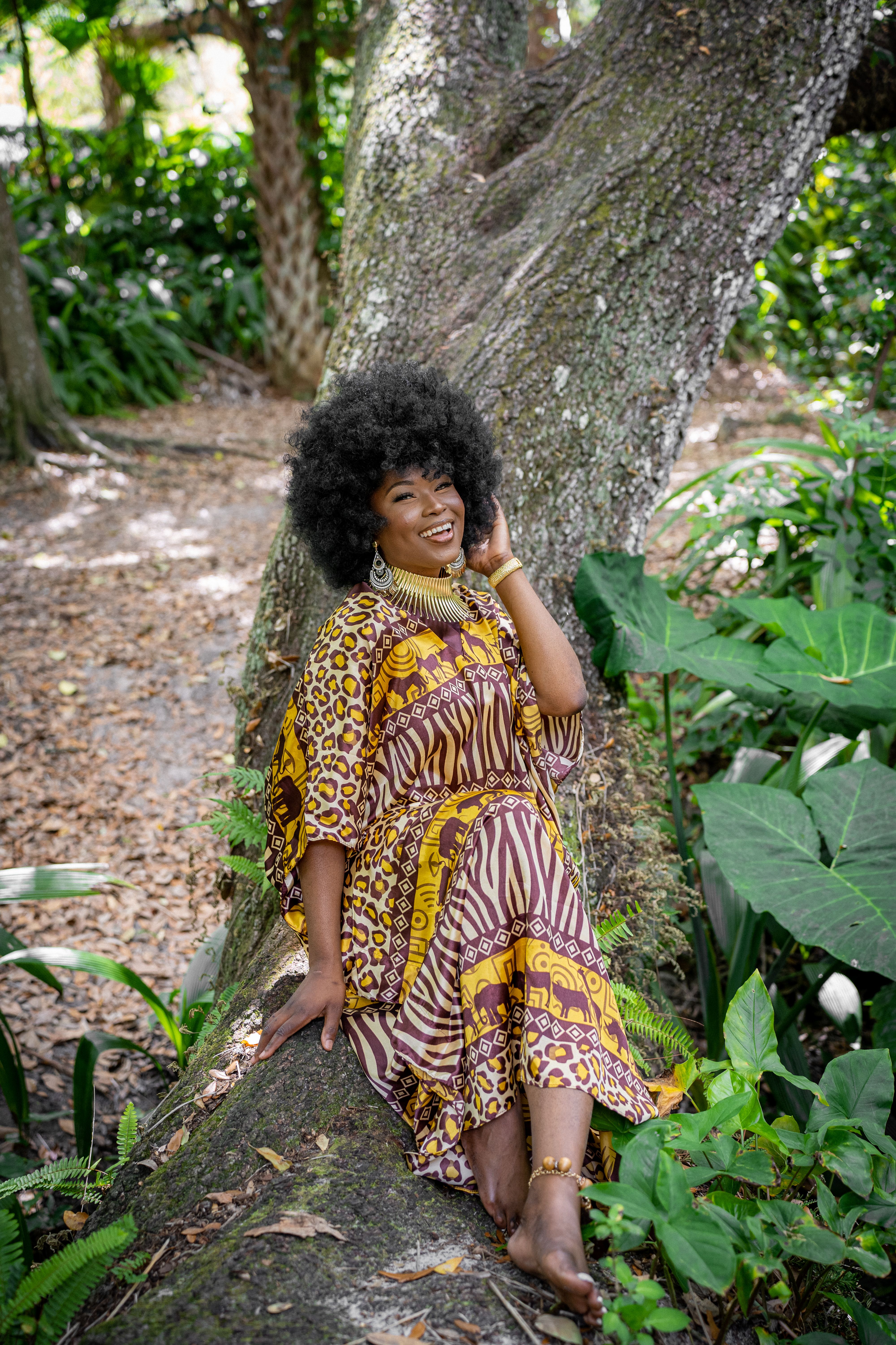 Woman with Afro Sitting under Tree · Free Stock Photo