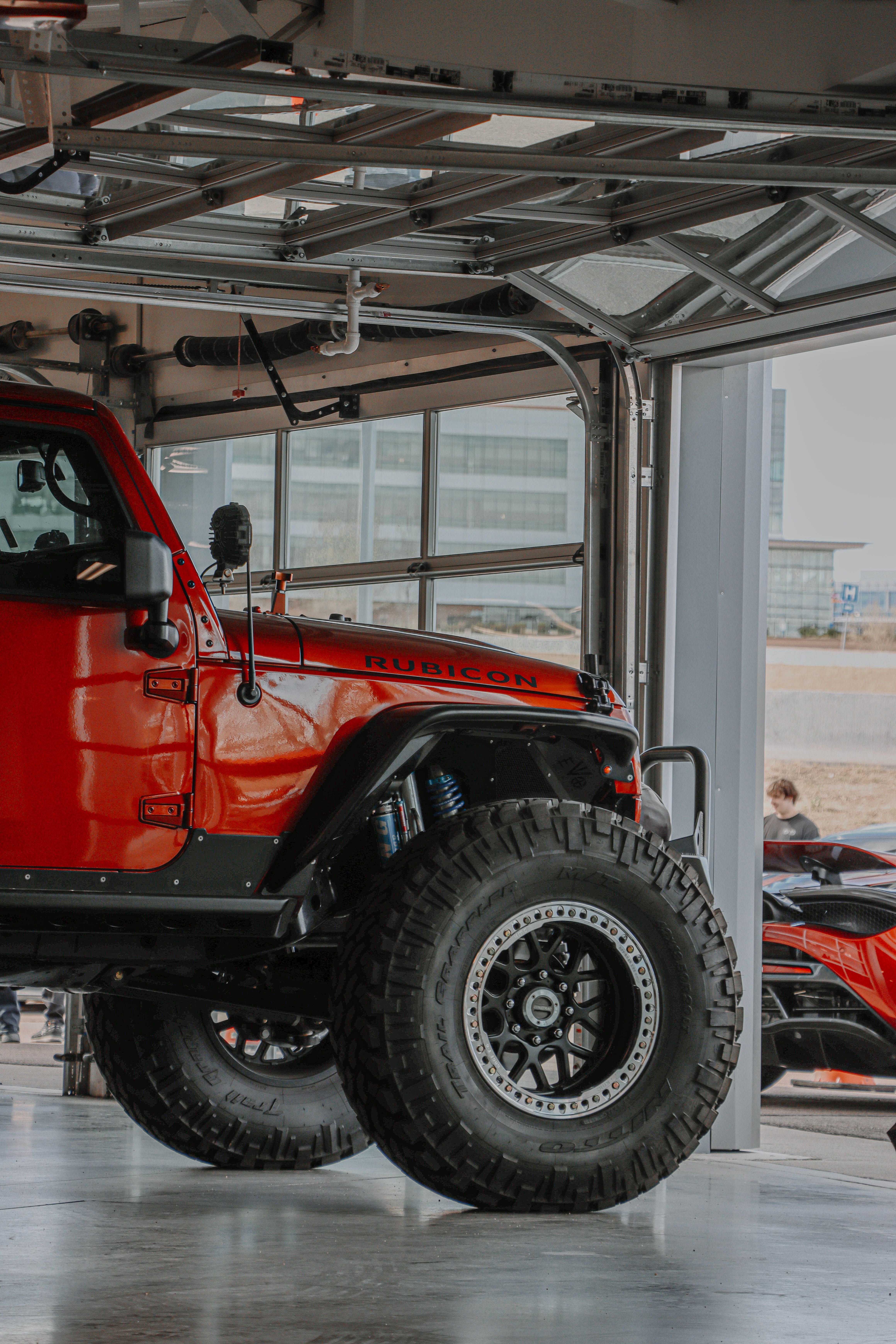 A Red Jeep Parked inside the Garage · Free Stock Photo