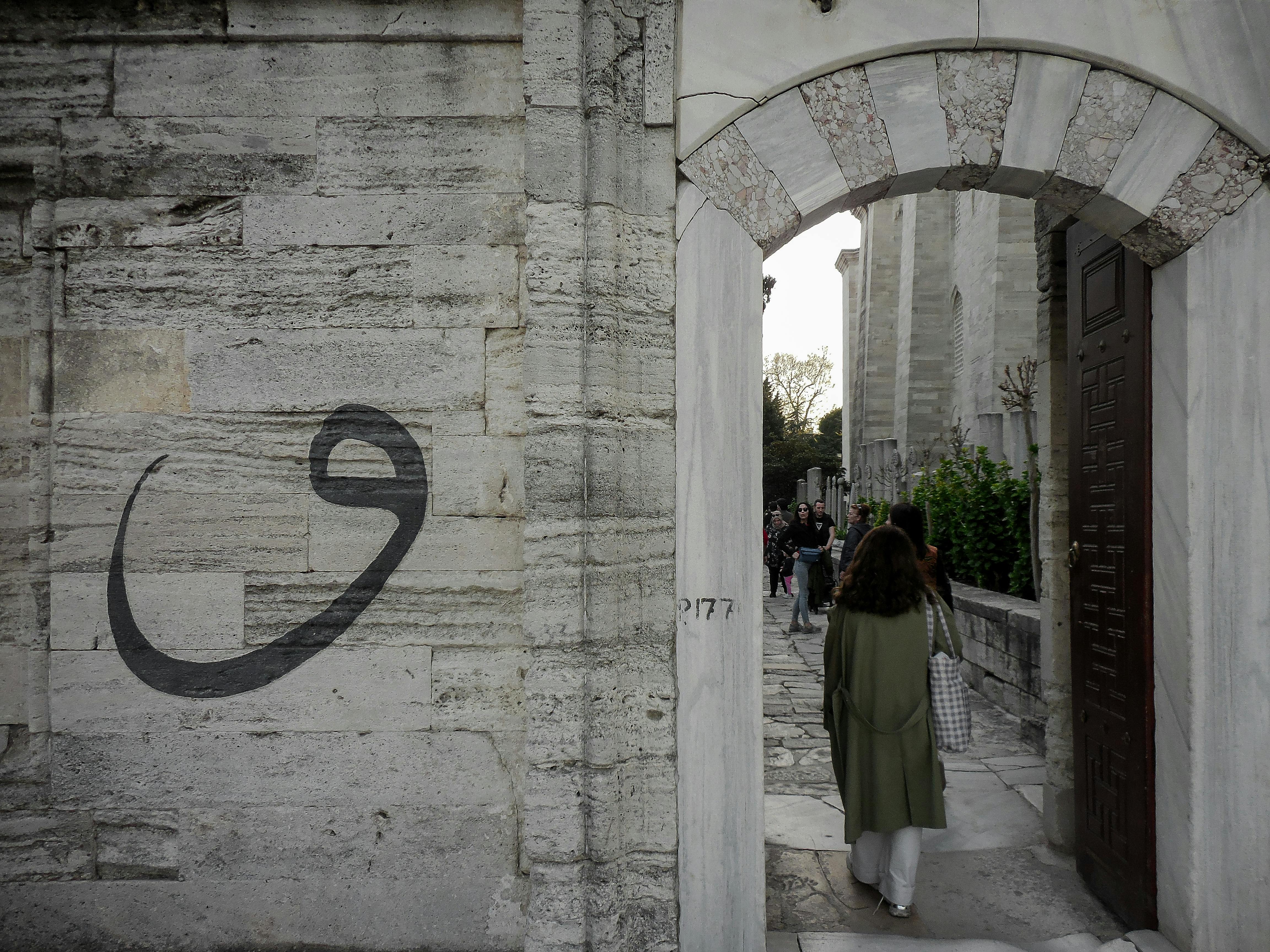 Man Standing Under Arch · Free Stock Photo