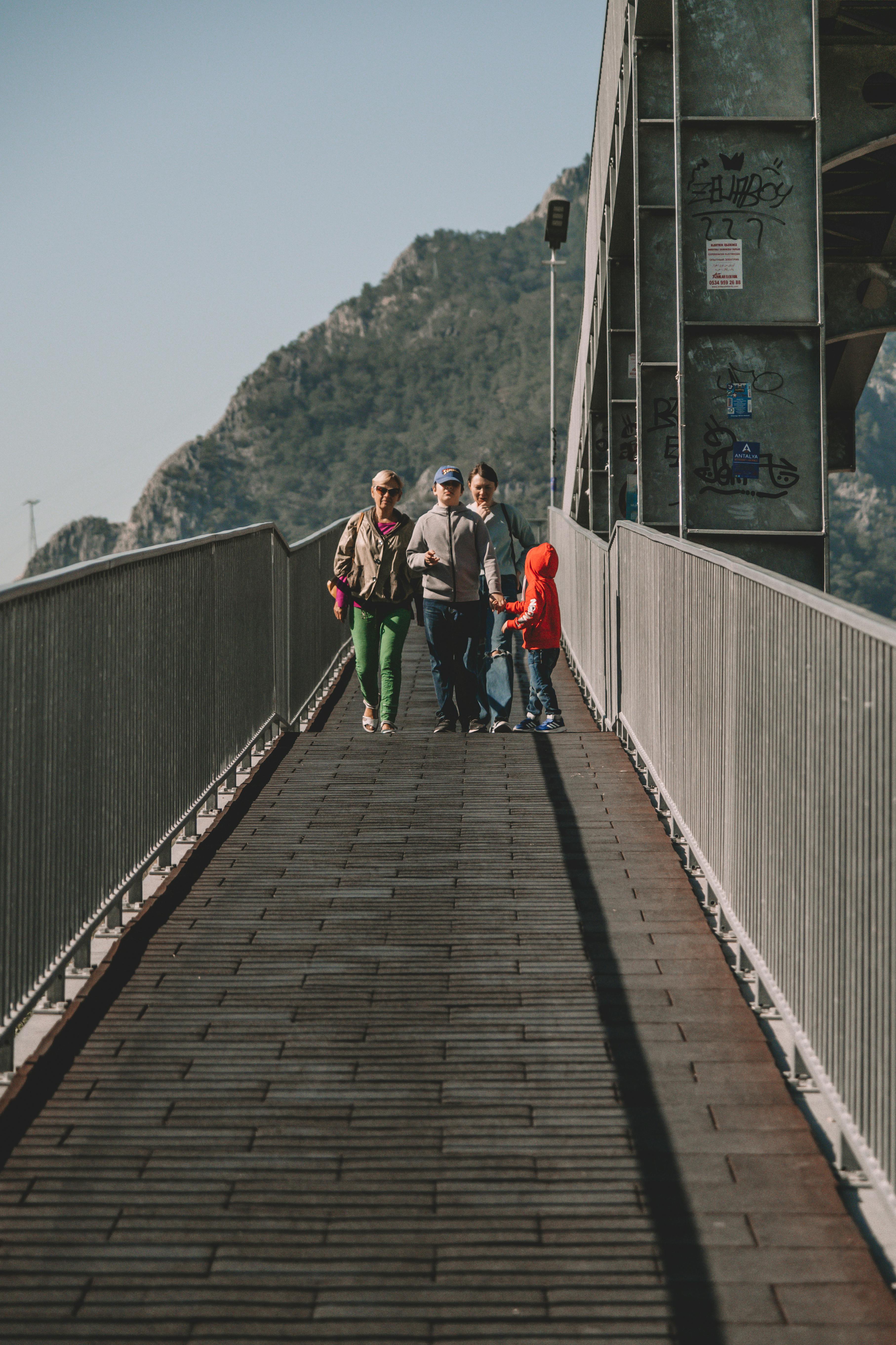 People Walking on Bridge · Free Stock Photo