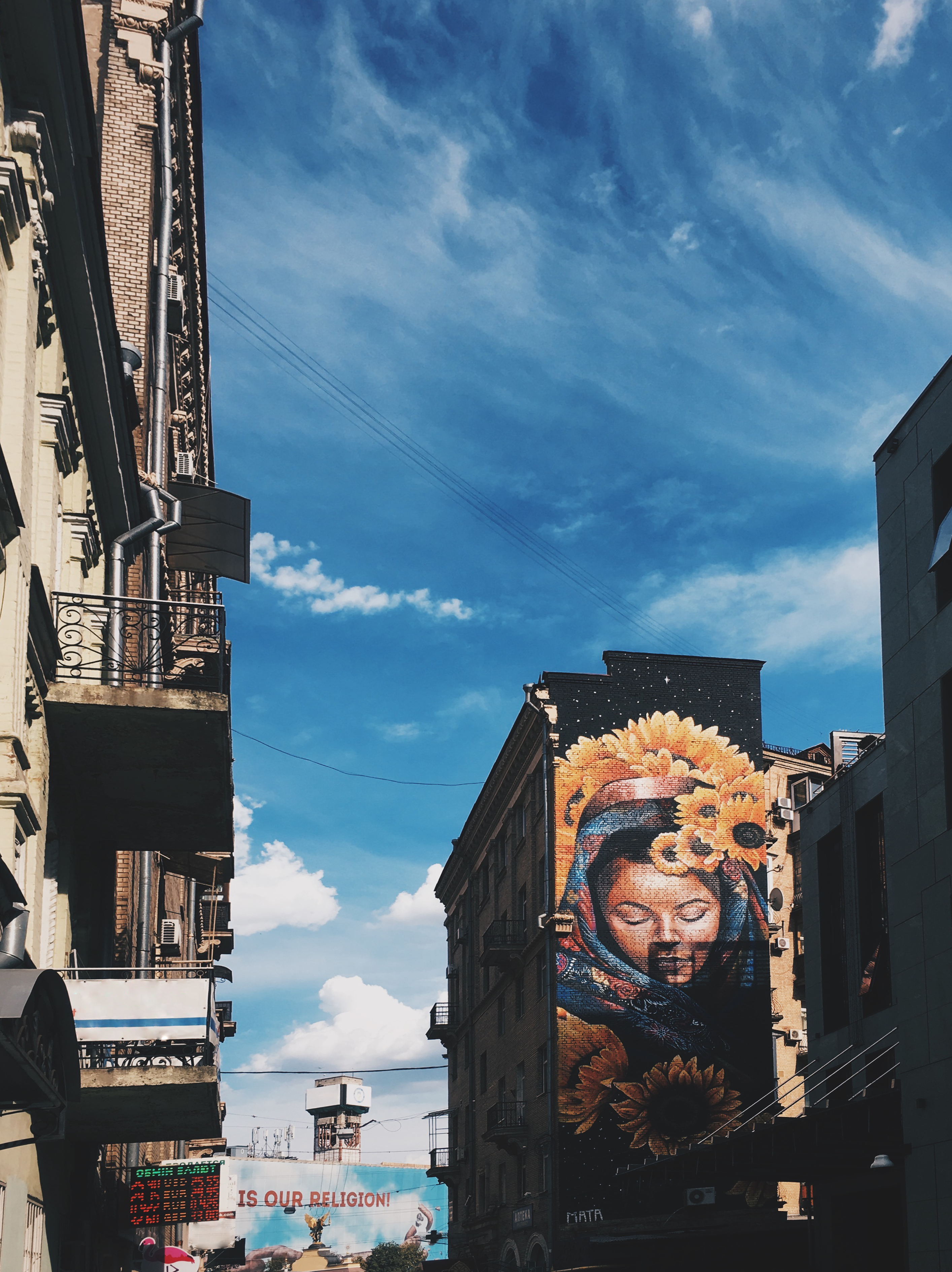 Graffiti Art on the Wall of an Apartment Building Under Blue Sky · Free ...