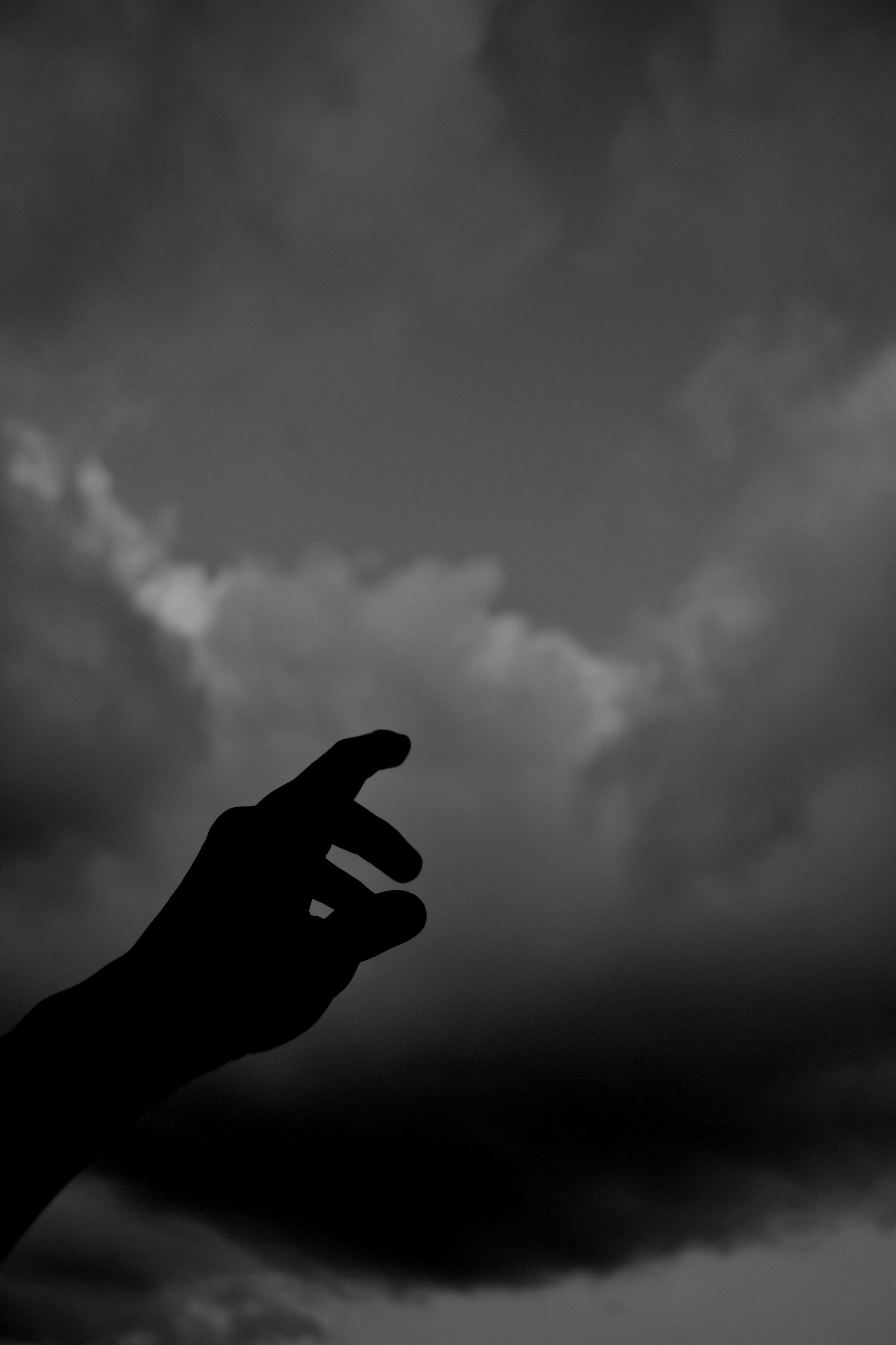 Grayscale Photo of Person's Hand Reaching For the Sky · Free Stock Photo