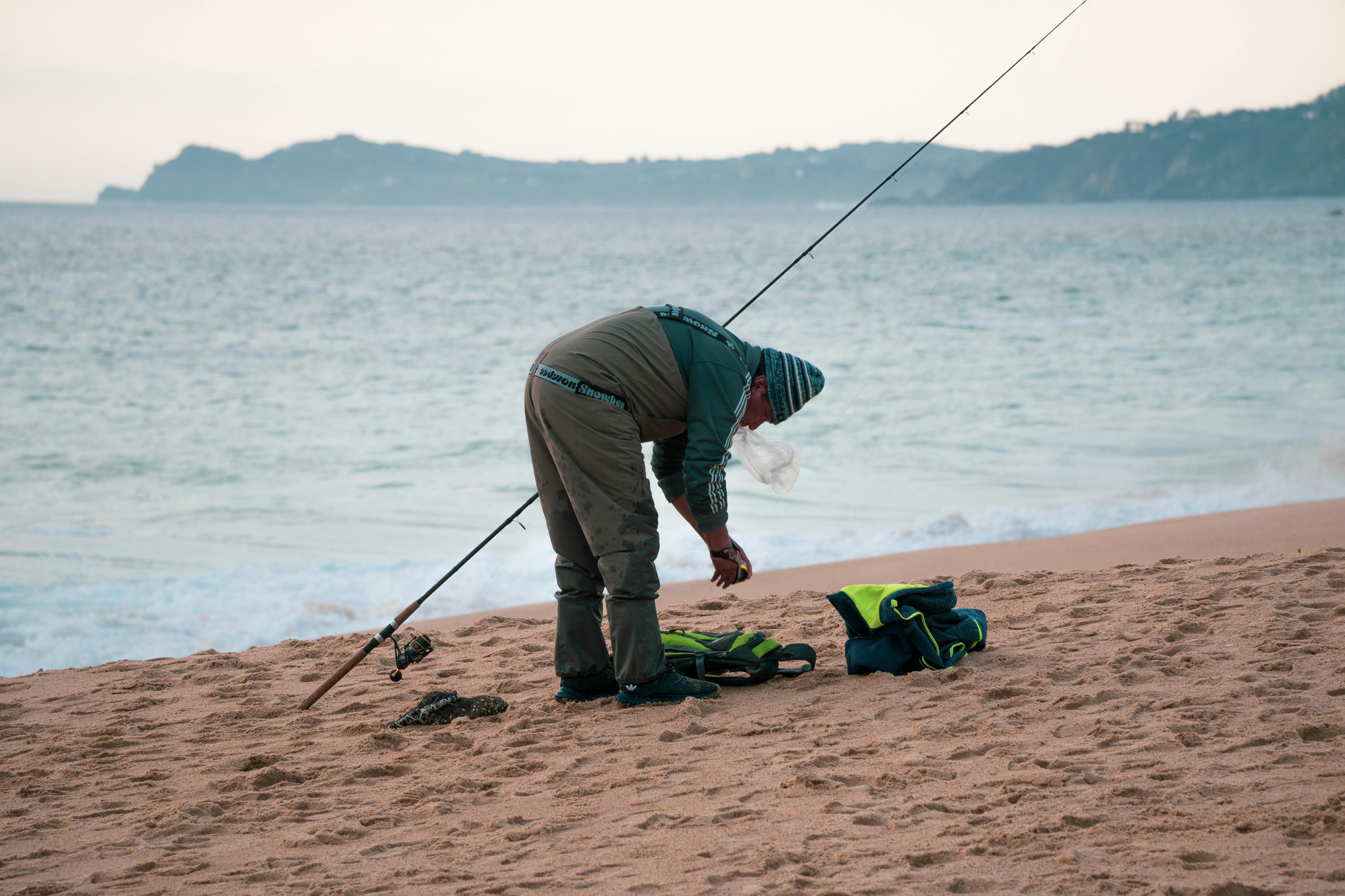 Fisherman on Beach · Free Stock Photo