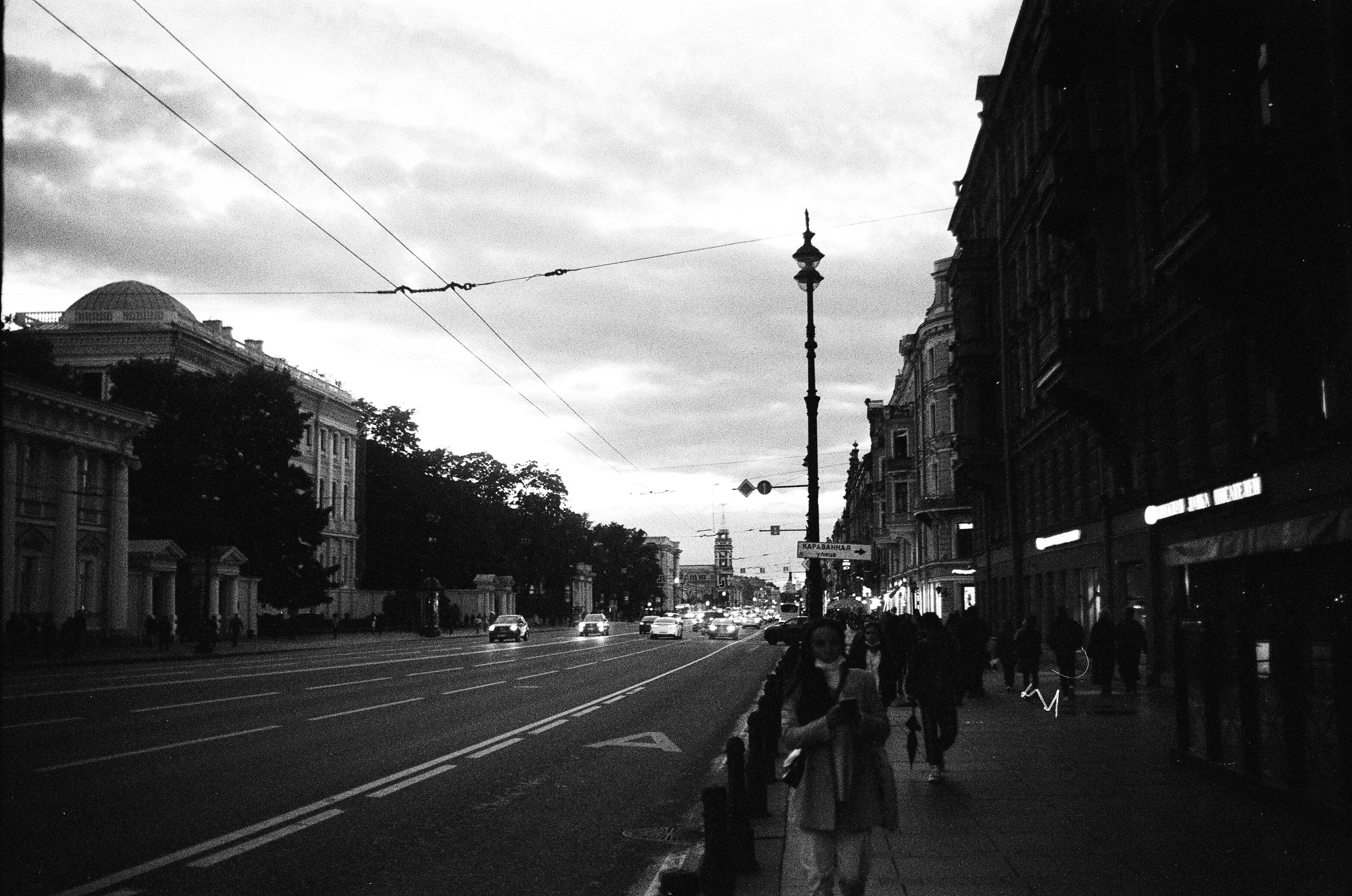 Grayscale Photo of People Walking on the Sidewalk · Free Stock Photo